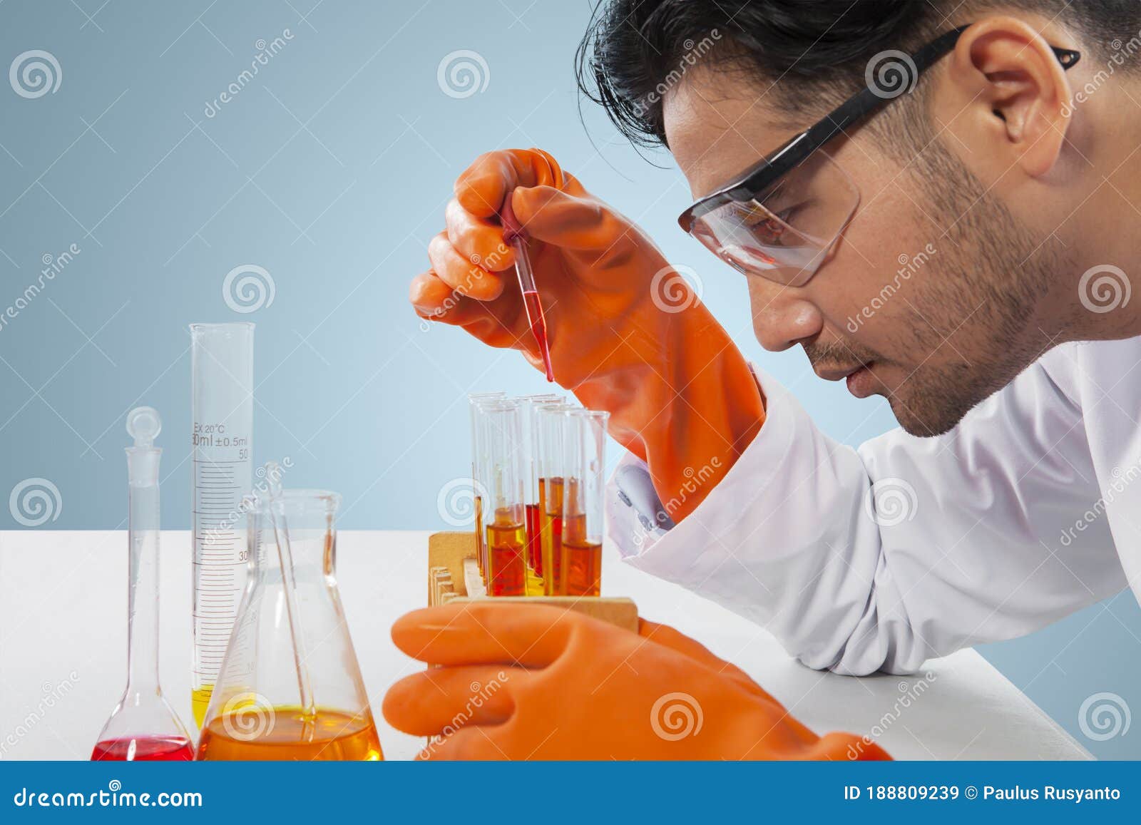 Male Researcher Analyzing Chemical Liquid on Studio Stock Image - Image ...