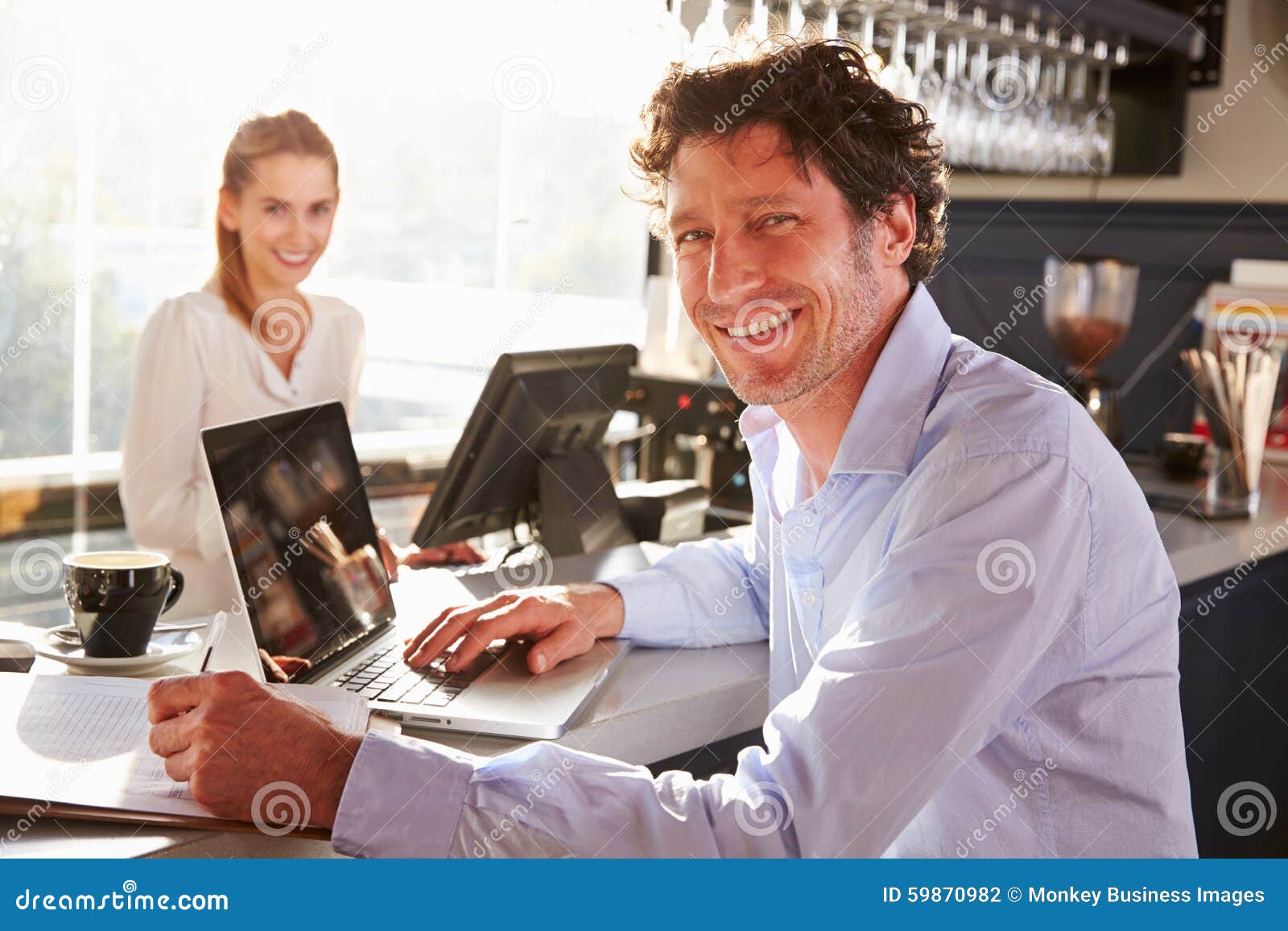 Male Restaurant Manager Working on Laptop Stock Photo - Image of ...