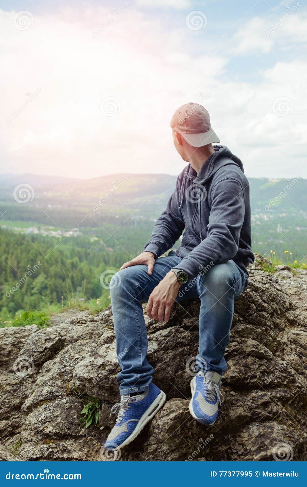 Male Resting and Enjoying the Mountain Sitting on Rock Stock Image ...