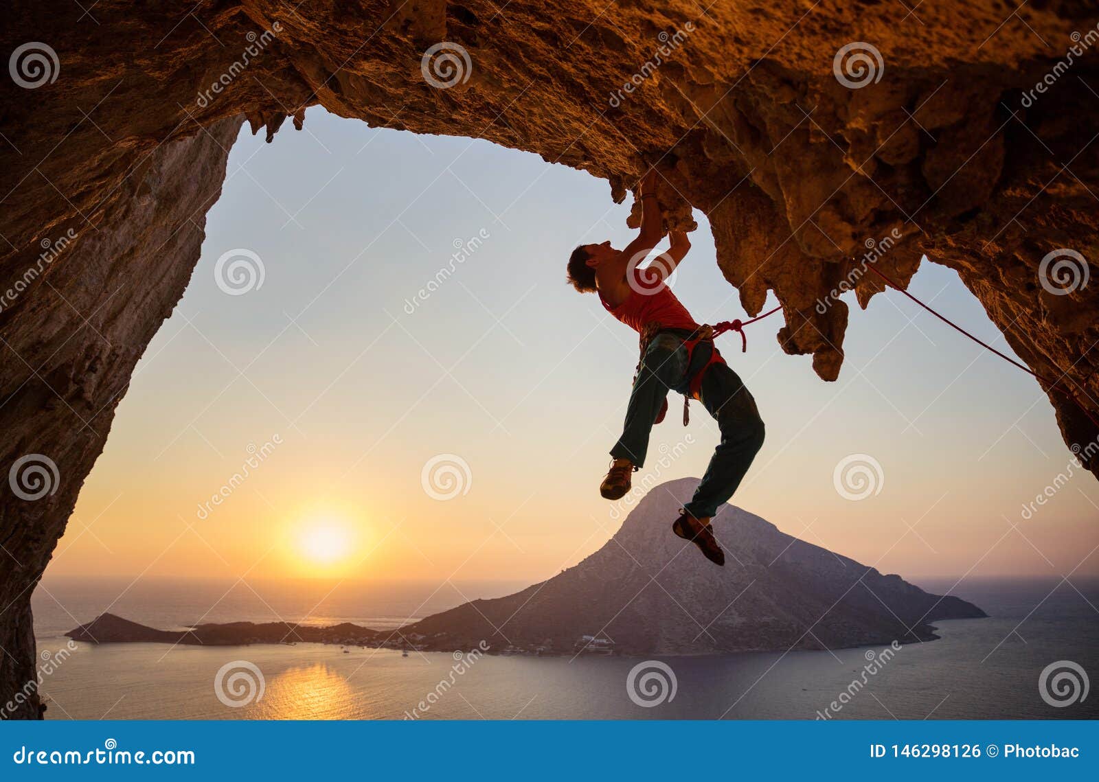 Male Rock Climber on Challenging Route on Cliff at Sunset Stock Photo ...