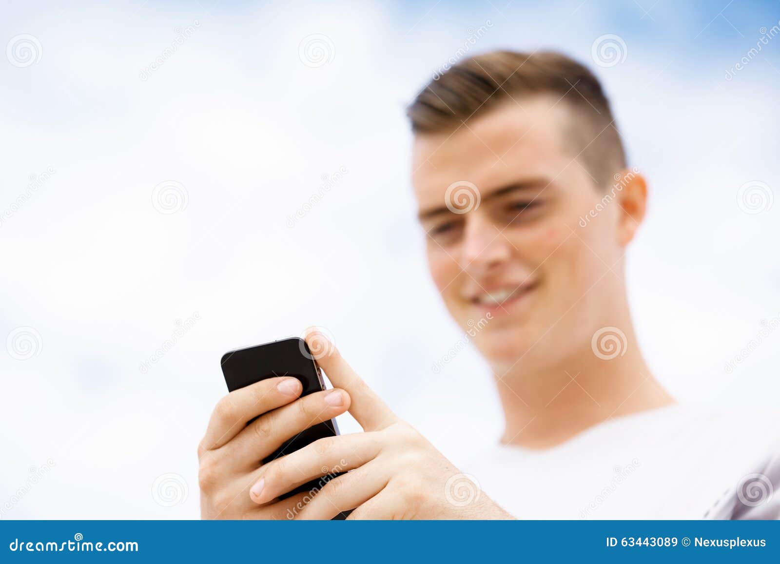 Male Runner with His Mobile Smart Phone Standing Stock Image - Image of ...