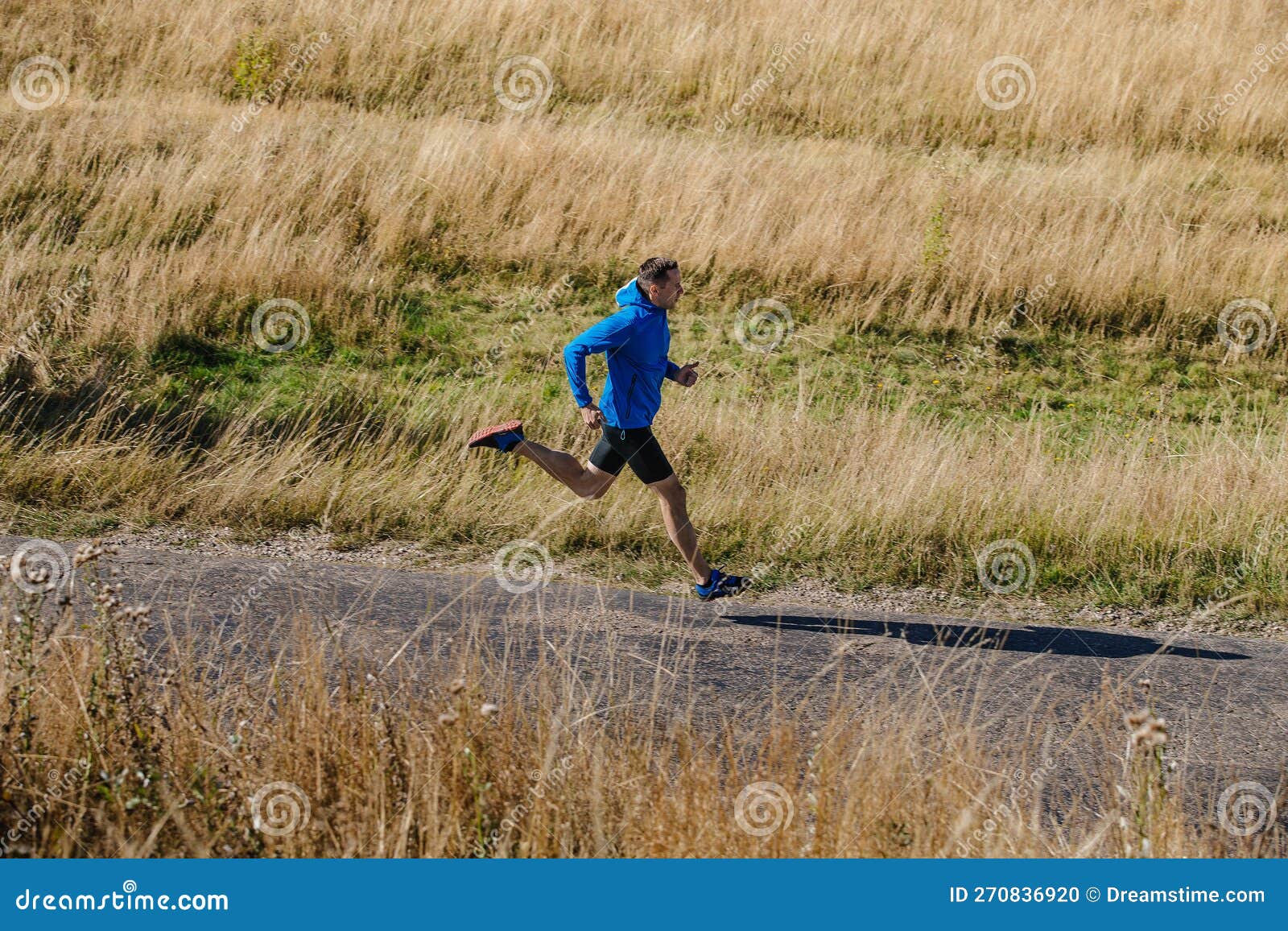 Male runner running road stock photo. Image of endurance - 270836920