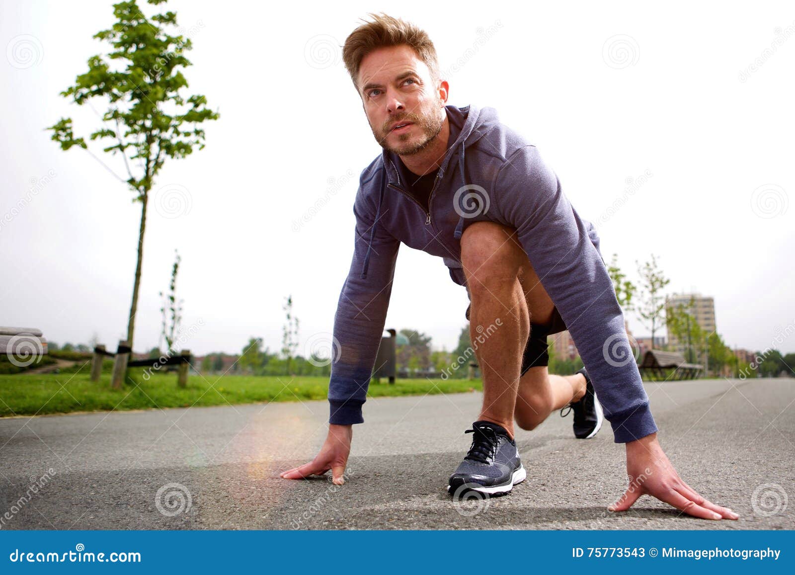 Male Runner Training in Starting Position Stock Image - Image of adult ...