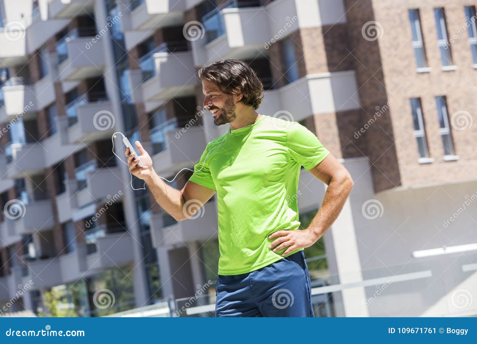 Male Runner Using Mobile Phone Outdoor Stock Image - Image of park ...