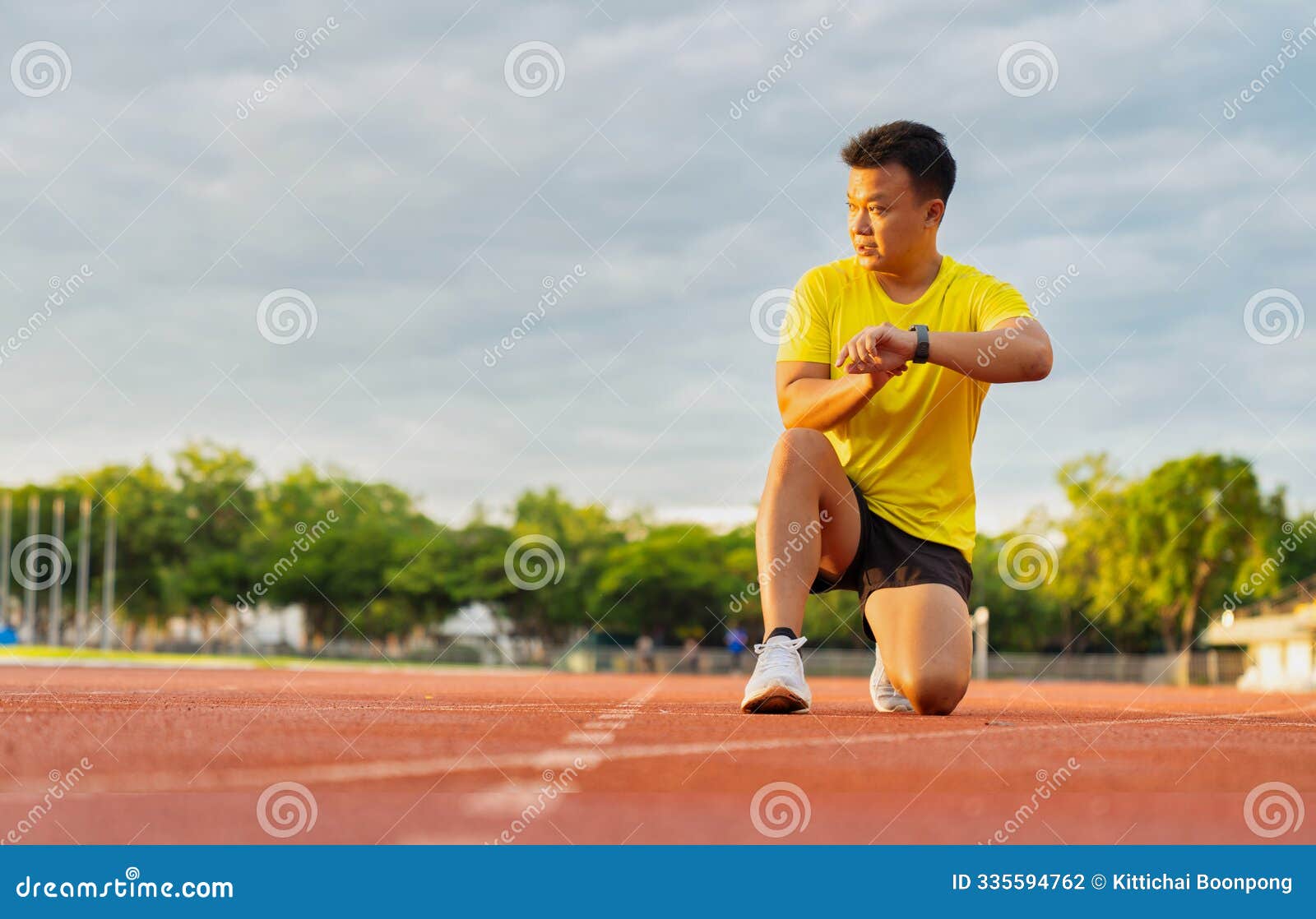 Male Runner Using Smartwatch To Track Workout Progress on the Running ...
