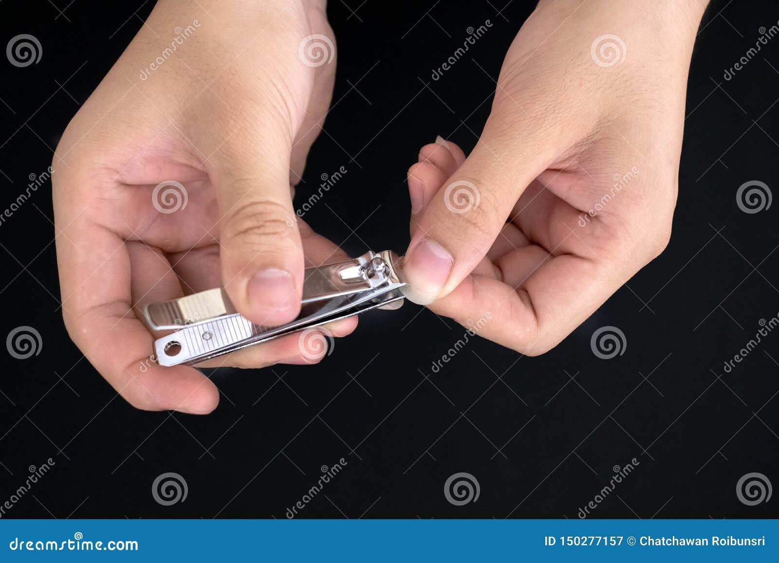 Male`s Hand Holding On Nail Clippers Man Use Nail Clipper Cutting Their