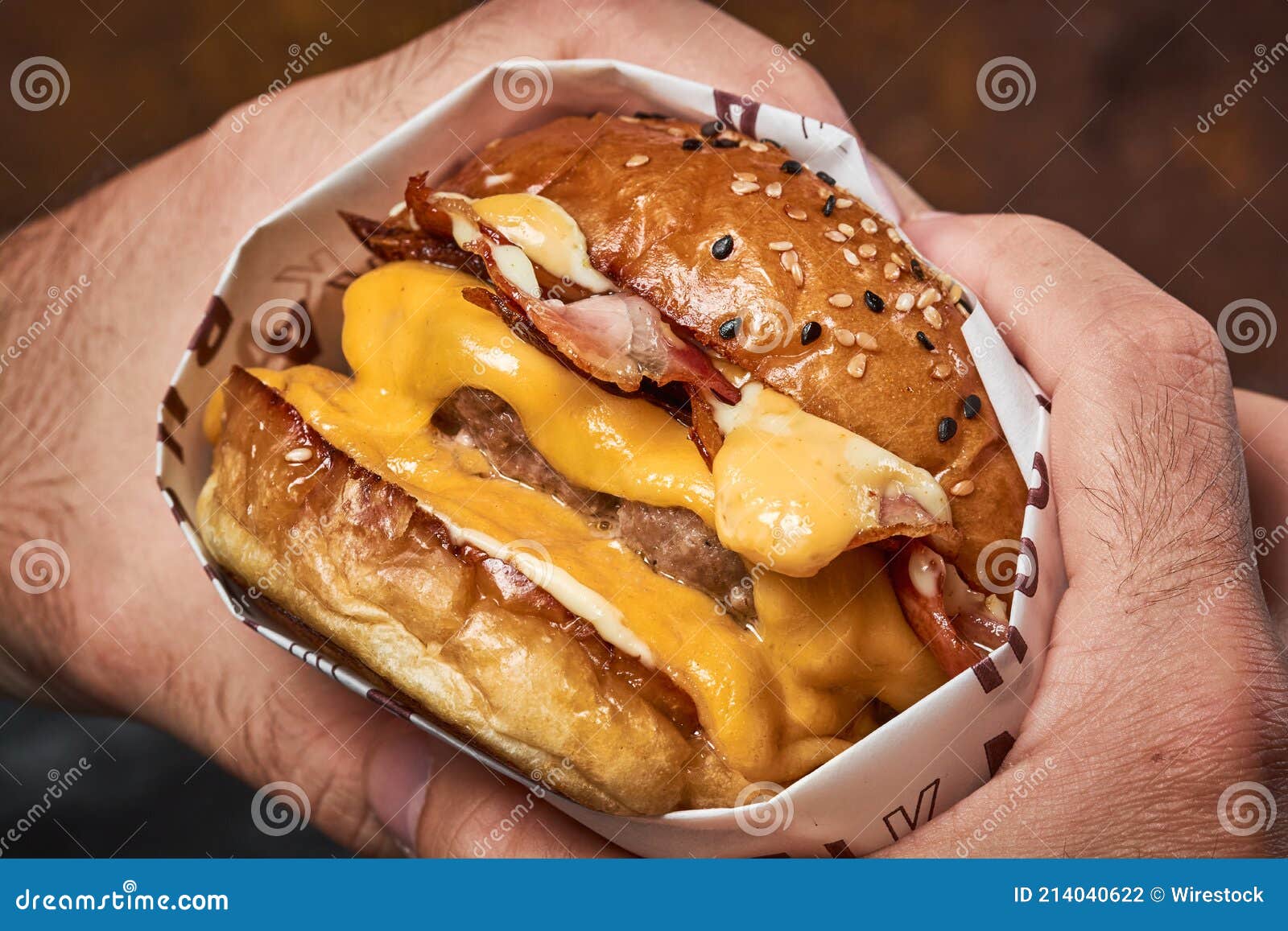 Male S Hands Holding a Delicious Double Cheeseburger Stock Photo ...
