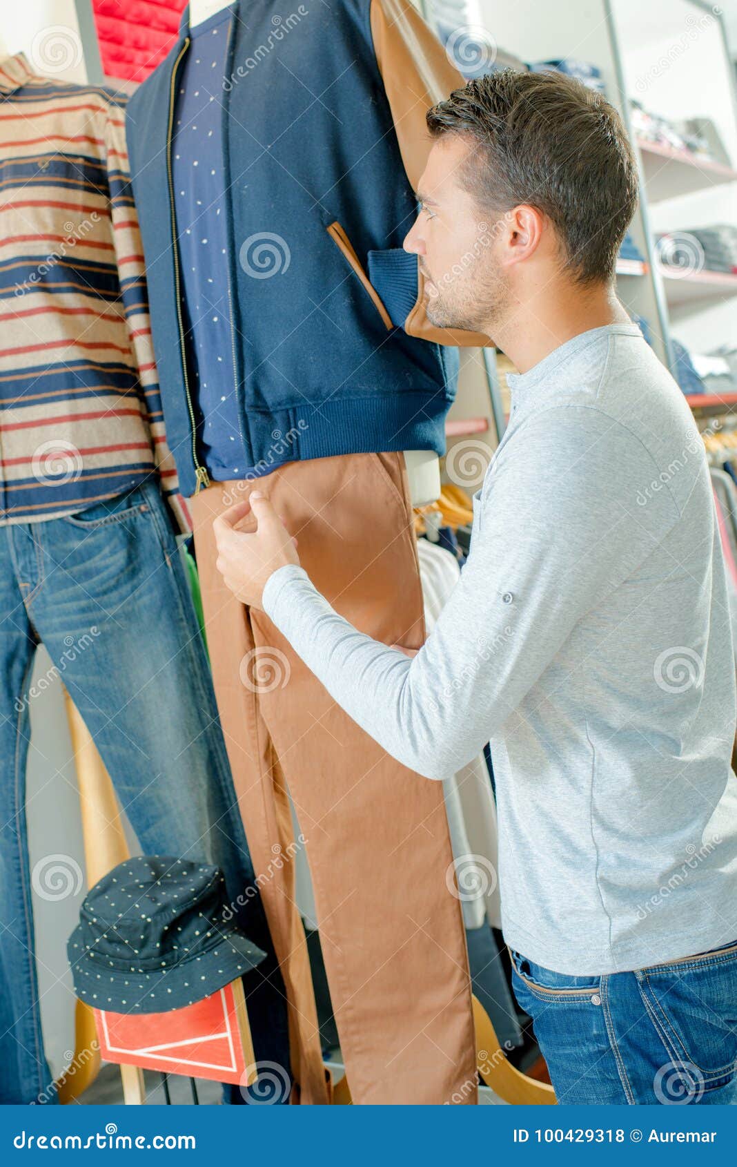 Male Sales Assistant in Clothes Shop Stock Photo - Image of person ...