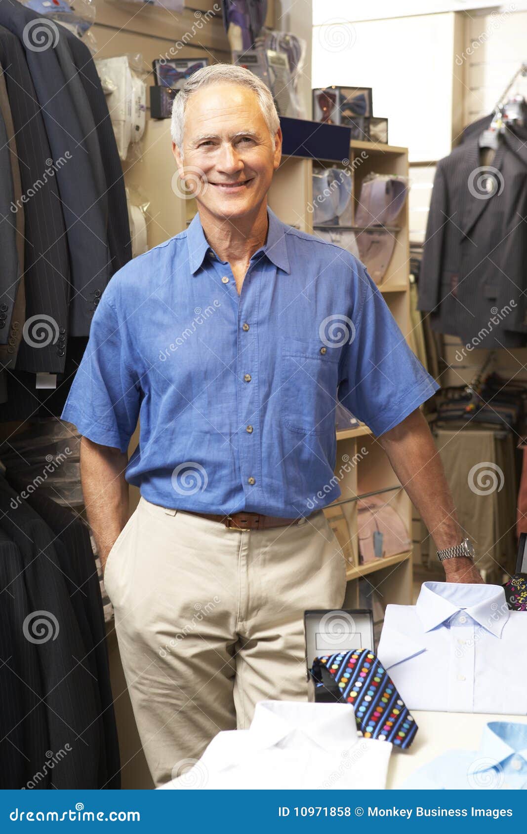 Male Sales Assistant in Clothing Store Stock Photo - Image of person ...