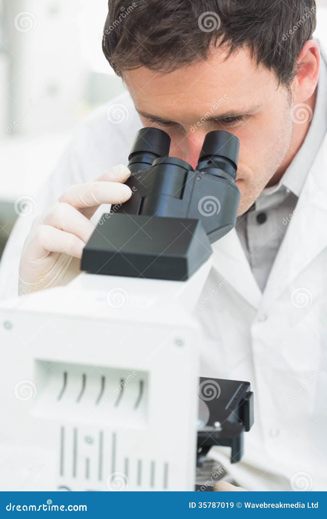 Male Scientific Researcher Using Microscope in Laboratory Stock Image ...