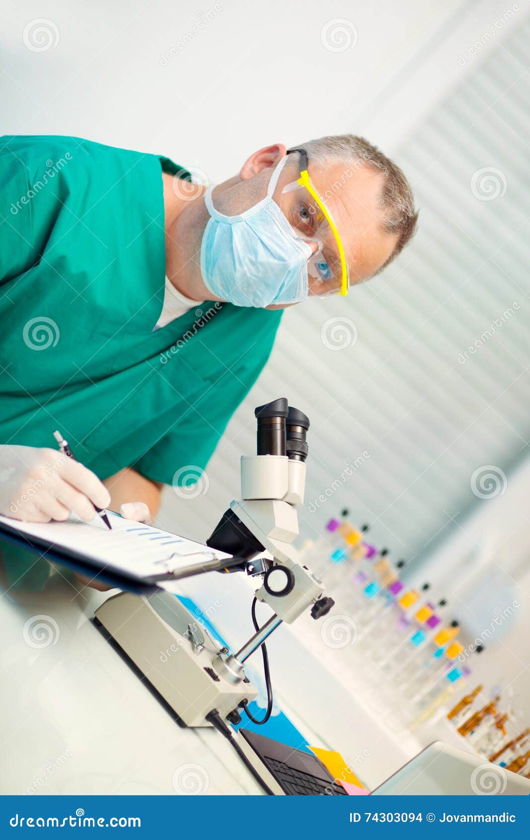 Male Scientific Researcher Using Microscope in the Laboratory Stock ...