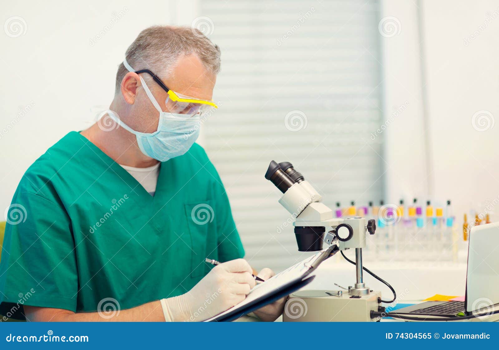 Male Scientific Researcher Using Microscope in the Laboratory Stock ...