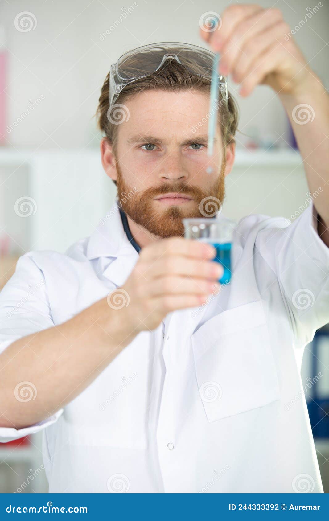 Male Scientist Dropping Liquid into Beaker Stock Photo - Image of beard ...