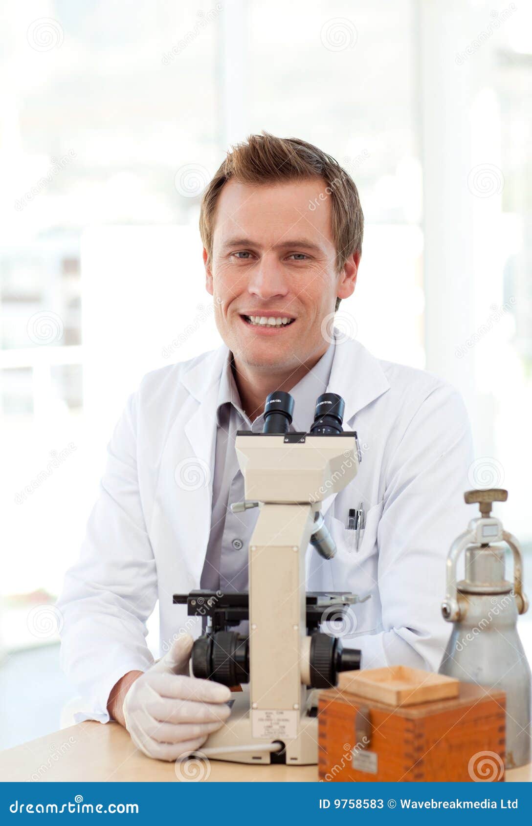 Male Scientist Looking through a Microscope Stock Image - Image of ...