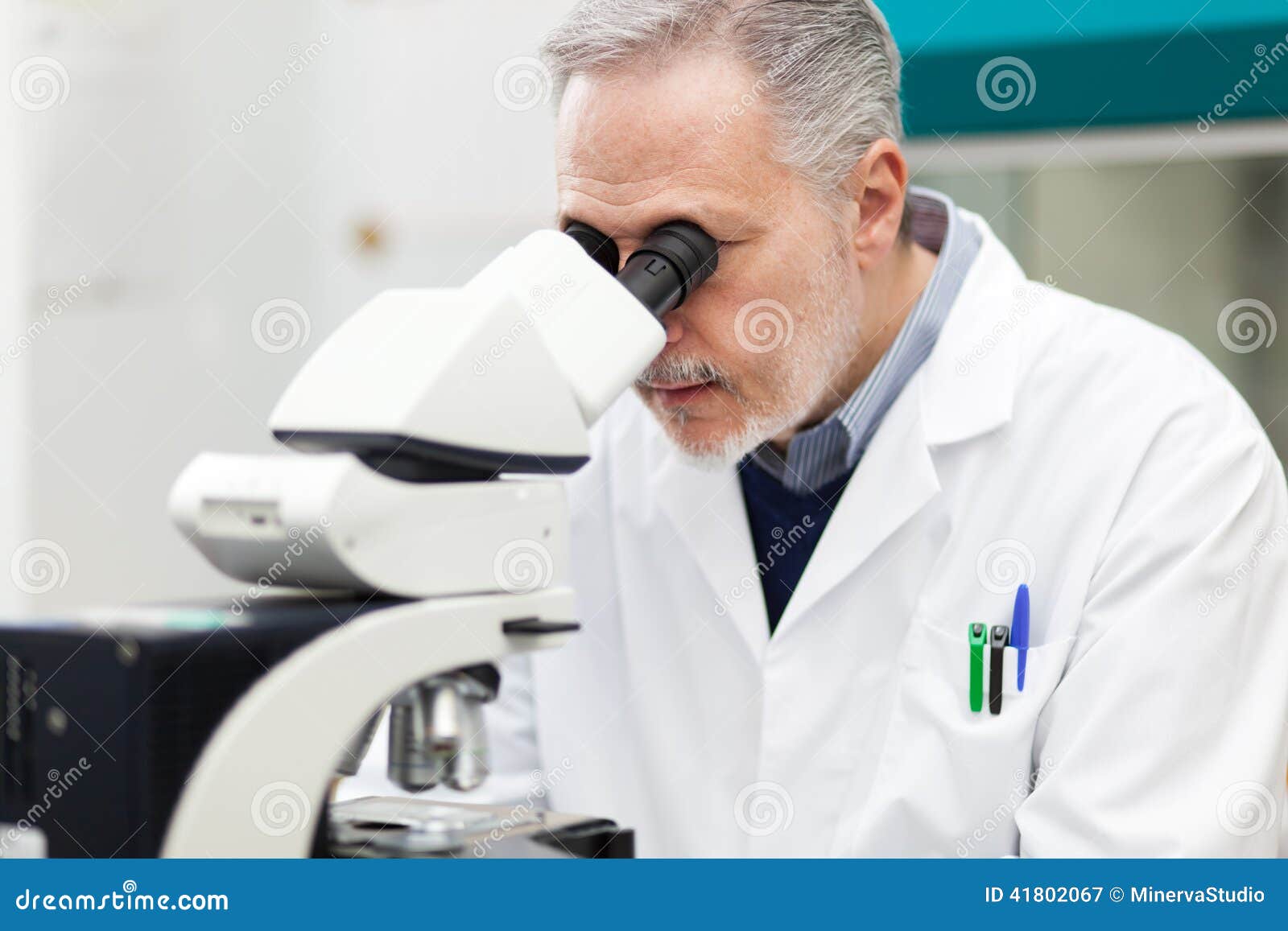 Male Scientist Looking through Microscope Stock Image - Image of mask ...