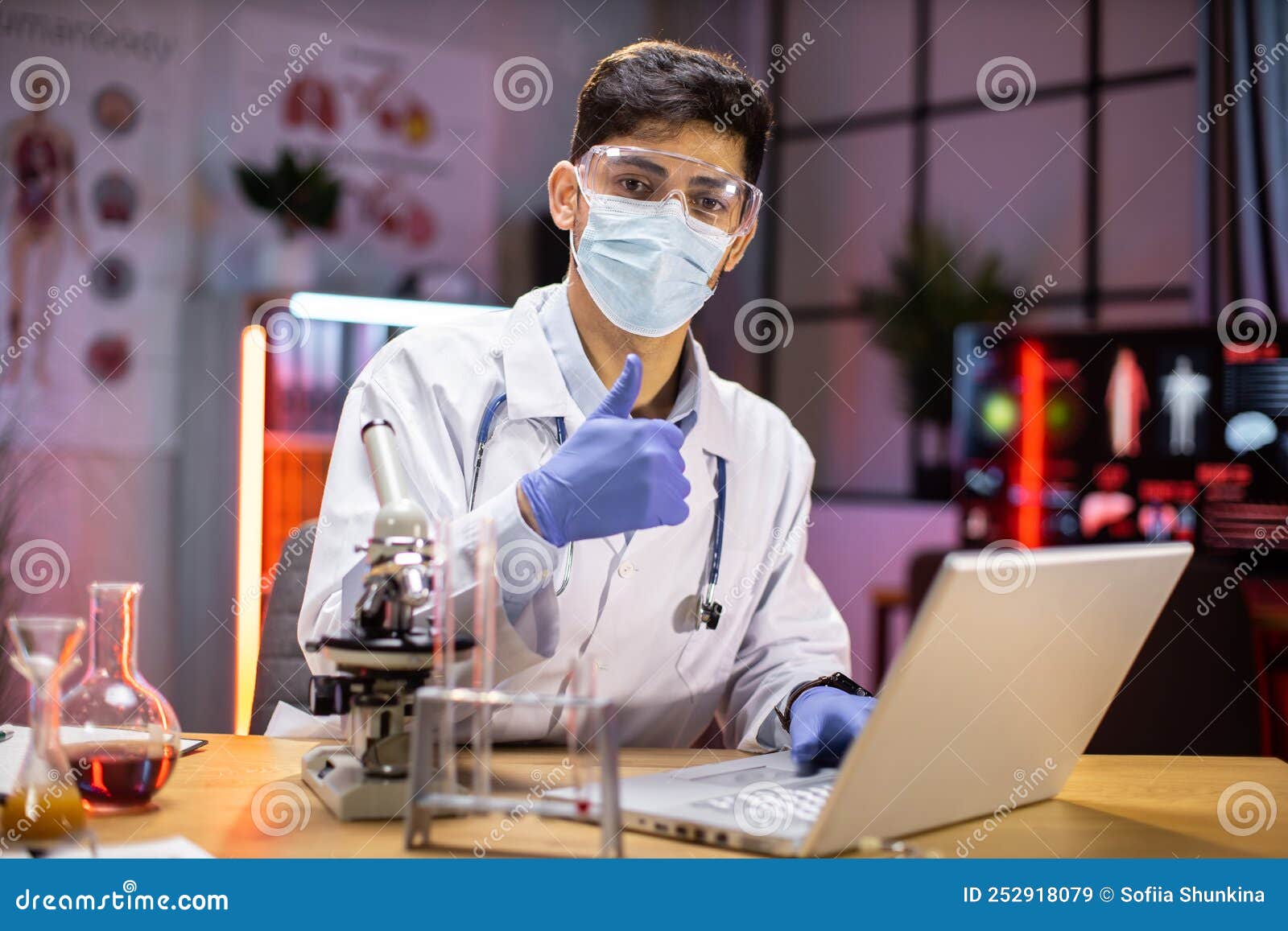 Male Scientist in Protective Mask and Gloves Testing Experiment in ...