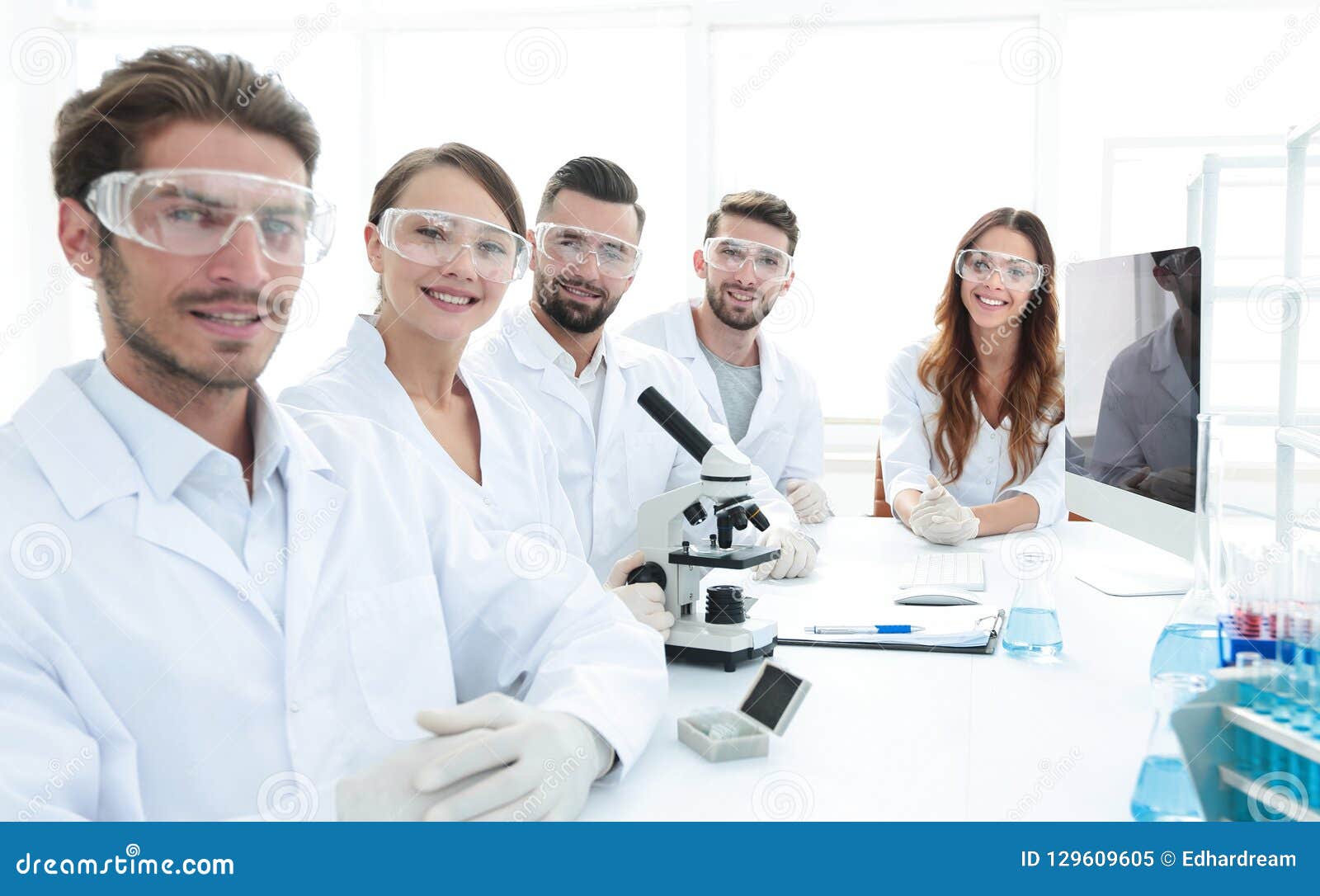 Male Scientist and the Team in the Lab. Stock Image - Image of ...