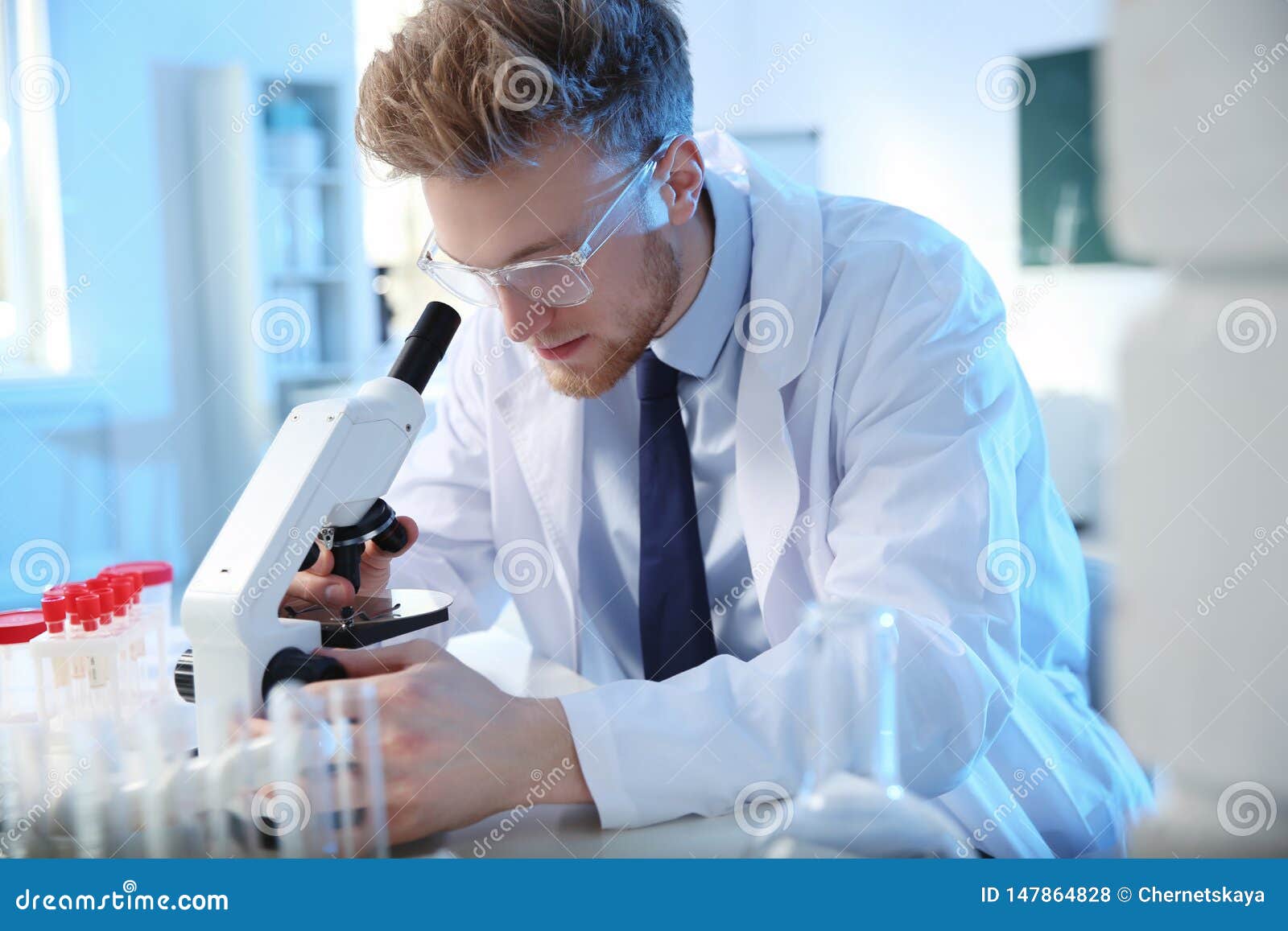 Male Scientist Using Modern Microscope in Chemistry Laboratory Stock ...