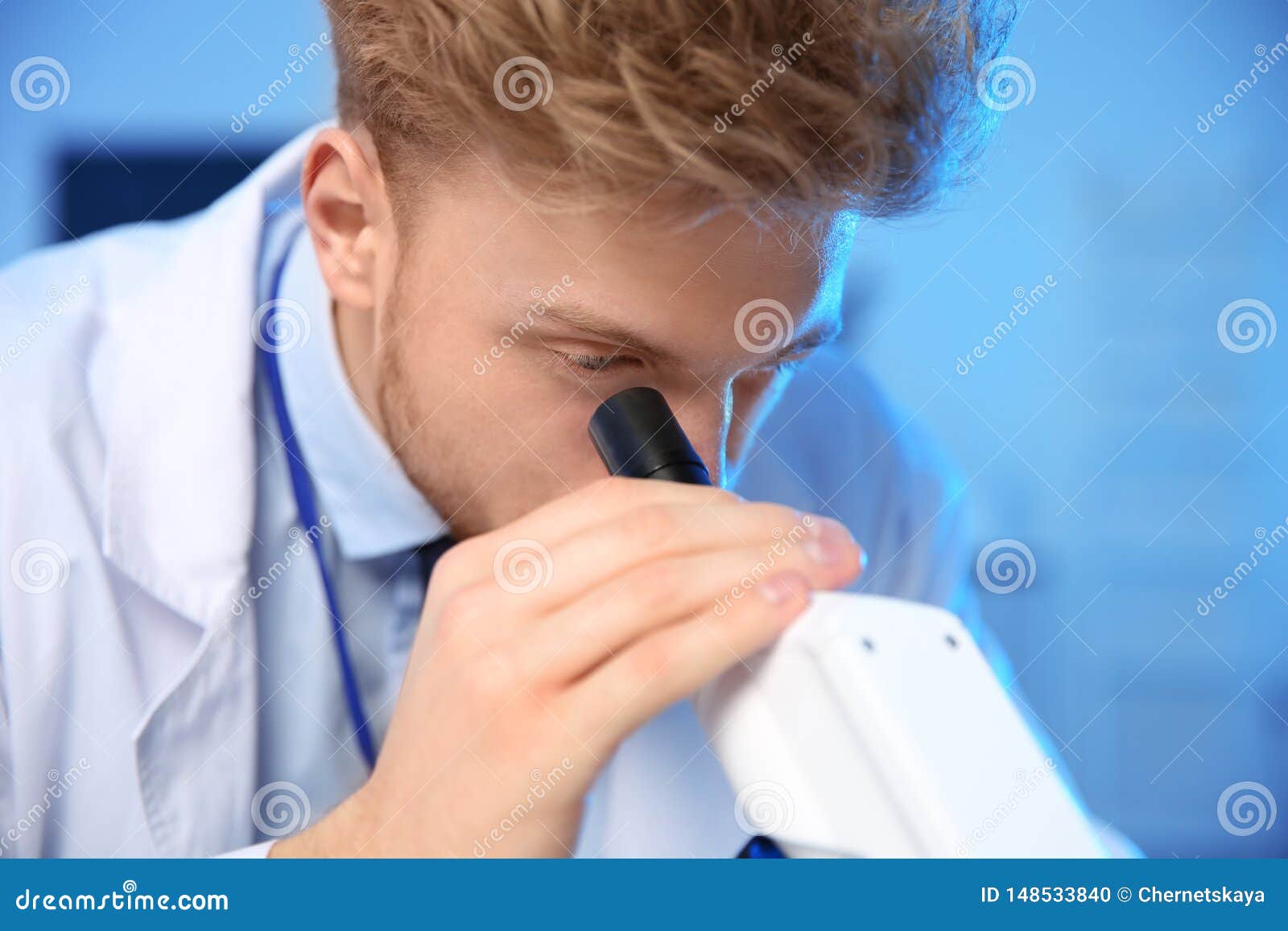 Male Scientist Using Microscope in Chemistry Laboratory Stock Photo ...