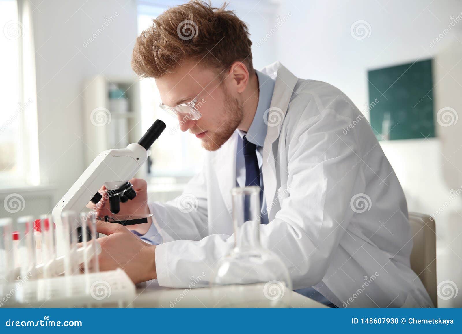 Male Scientist Using Modern Microscope in Laboratory Stock Photo ...