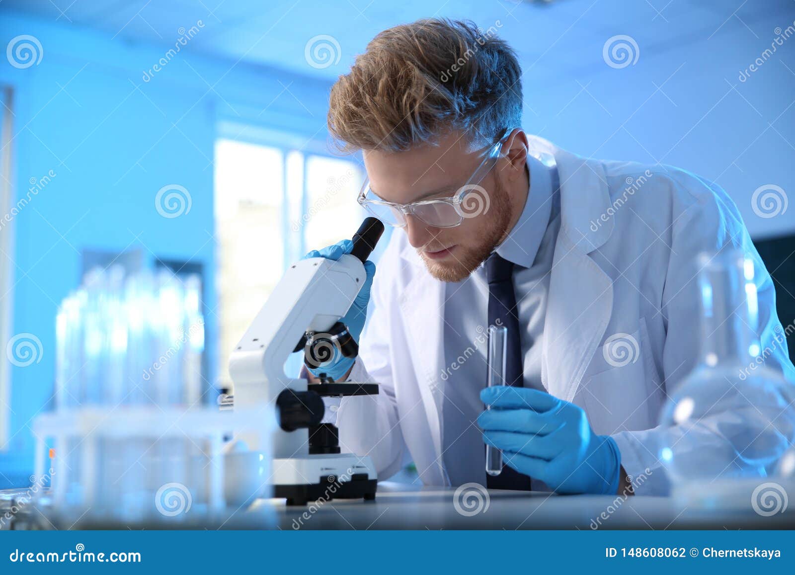 Male Scientist Using Modern Microscope in Laboratory Stock Photo ...
