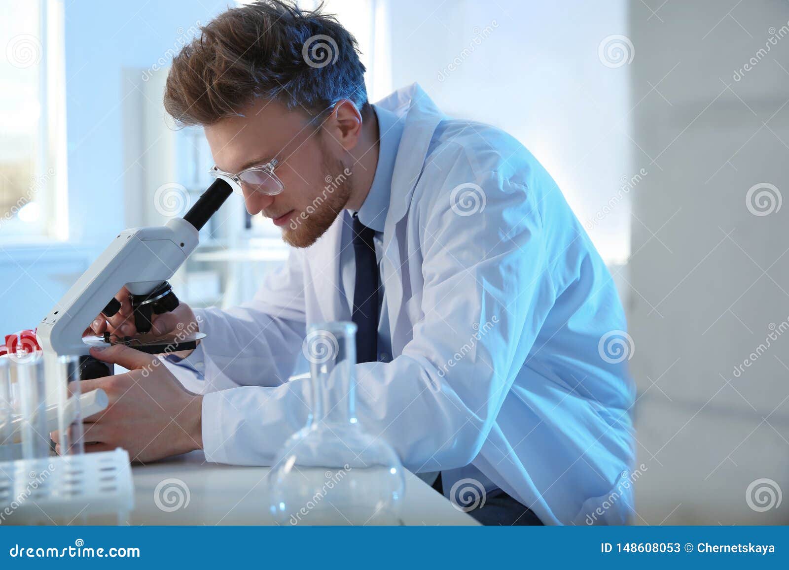 Male Scientist Using Modern Microscope in Laboratory Stock Image ...