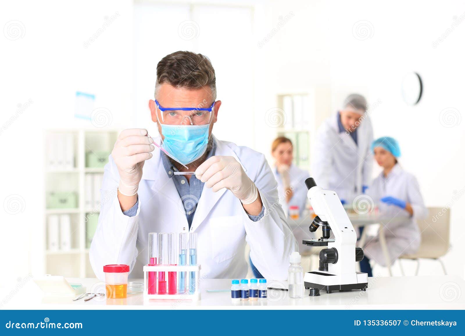 Male Scientist Working at Table in Laboratory, Space for Text Stock ...