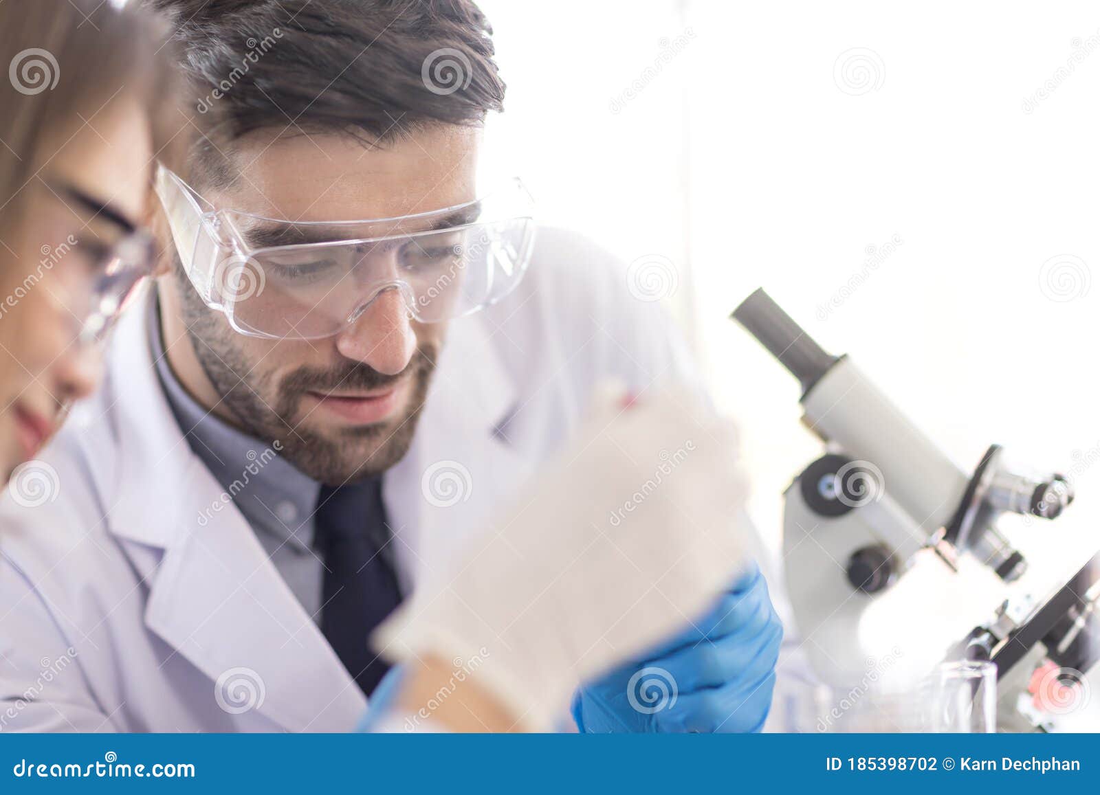 Male Scientists is Experimenting with Chemicals in the Laboratory Stock ... Male Scientists is Experimenting with Chemicals in the Laboratory Stock ...