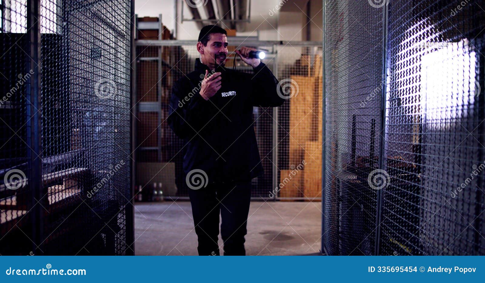 Male Security Guard or Bodyguard Using Flashlight Stock Photo - Image ...