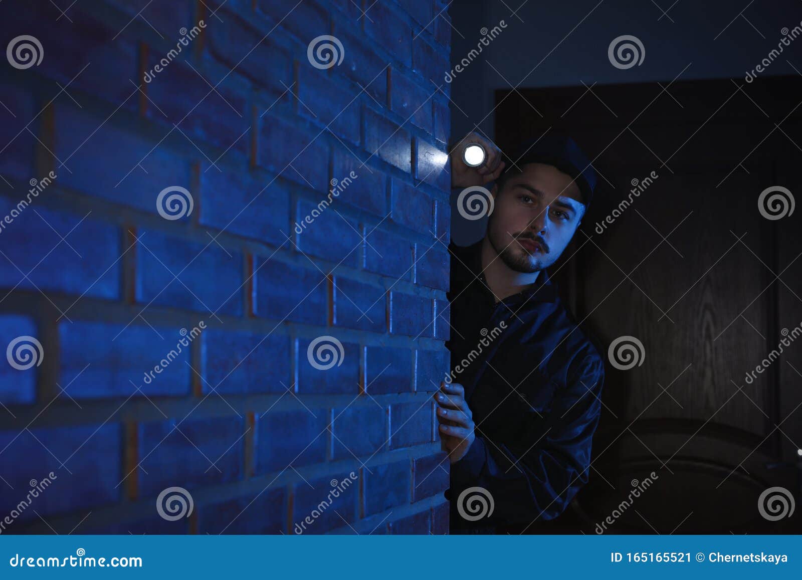 Male Security Guard with Flashlight in Corridor Stock Image - Image of ...