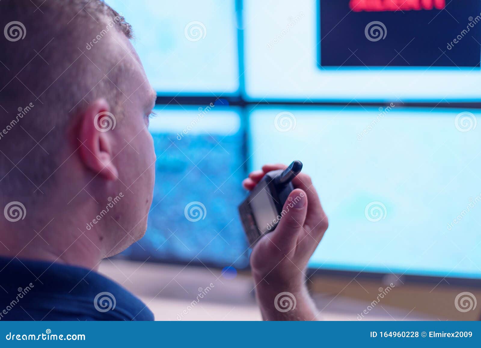 Male Security Guard Operator Talking on the Phone, Calling in the ...