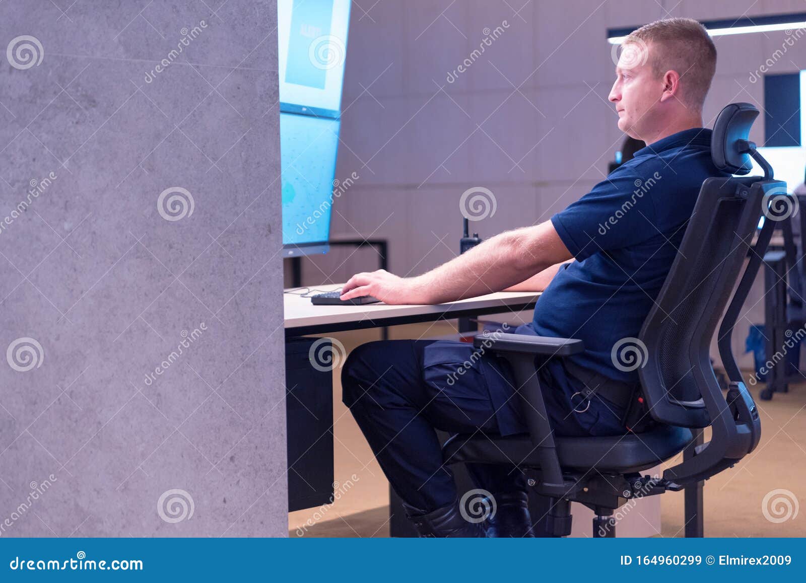 Male Security Guard Operator Talking on the Phone, Calling in the ...