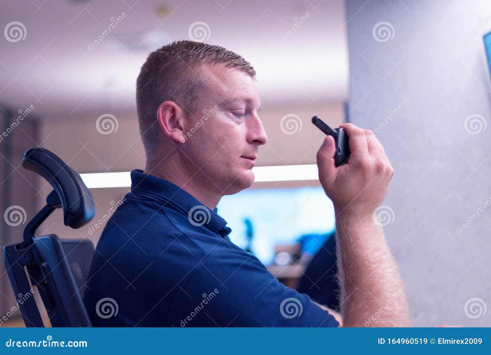 Male Security Guard Operator Talking on the Phone, Calling in the ...