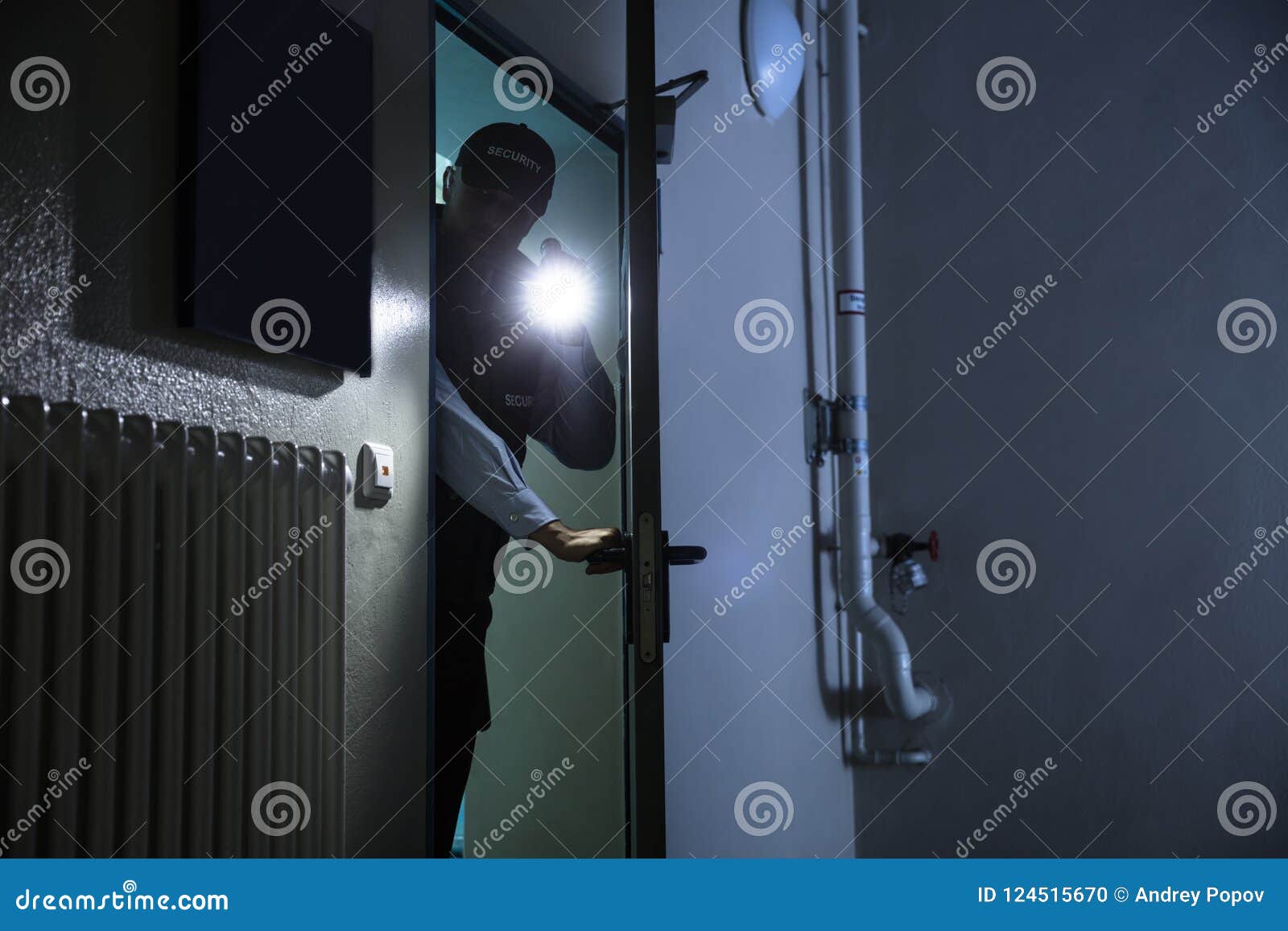 Male Security Guard Searching with Flashlight Stock Photo - Image of ...