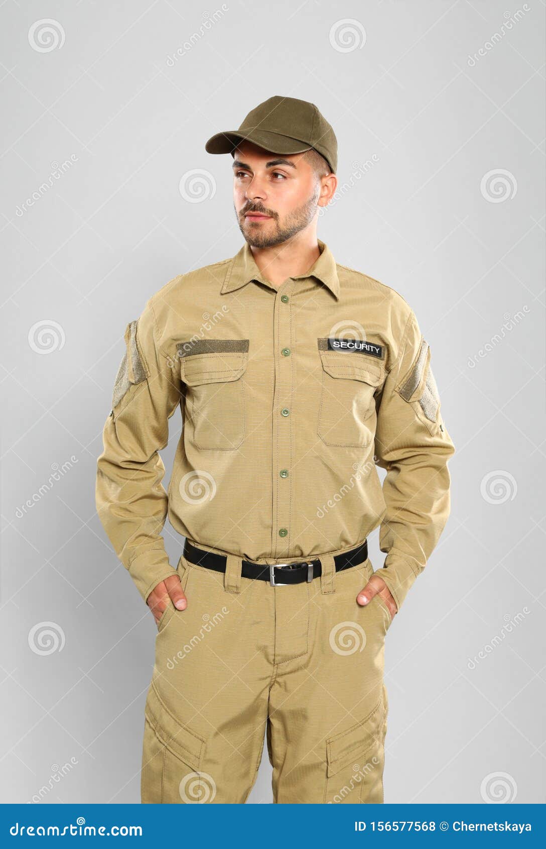 Male Security in Uniform on Grey Background Stock Photo - Image of ...