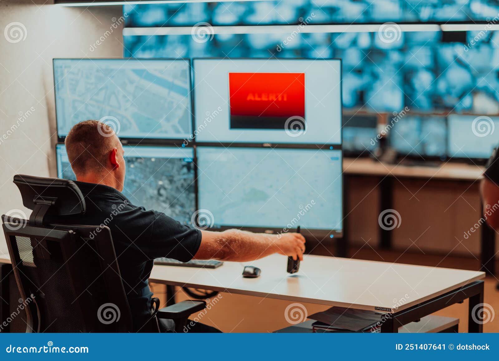 Male Security Operator Working in a Data System Control Room Offices ...