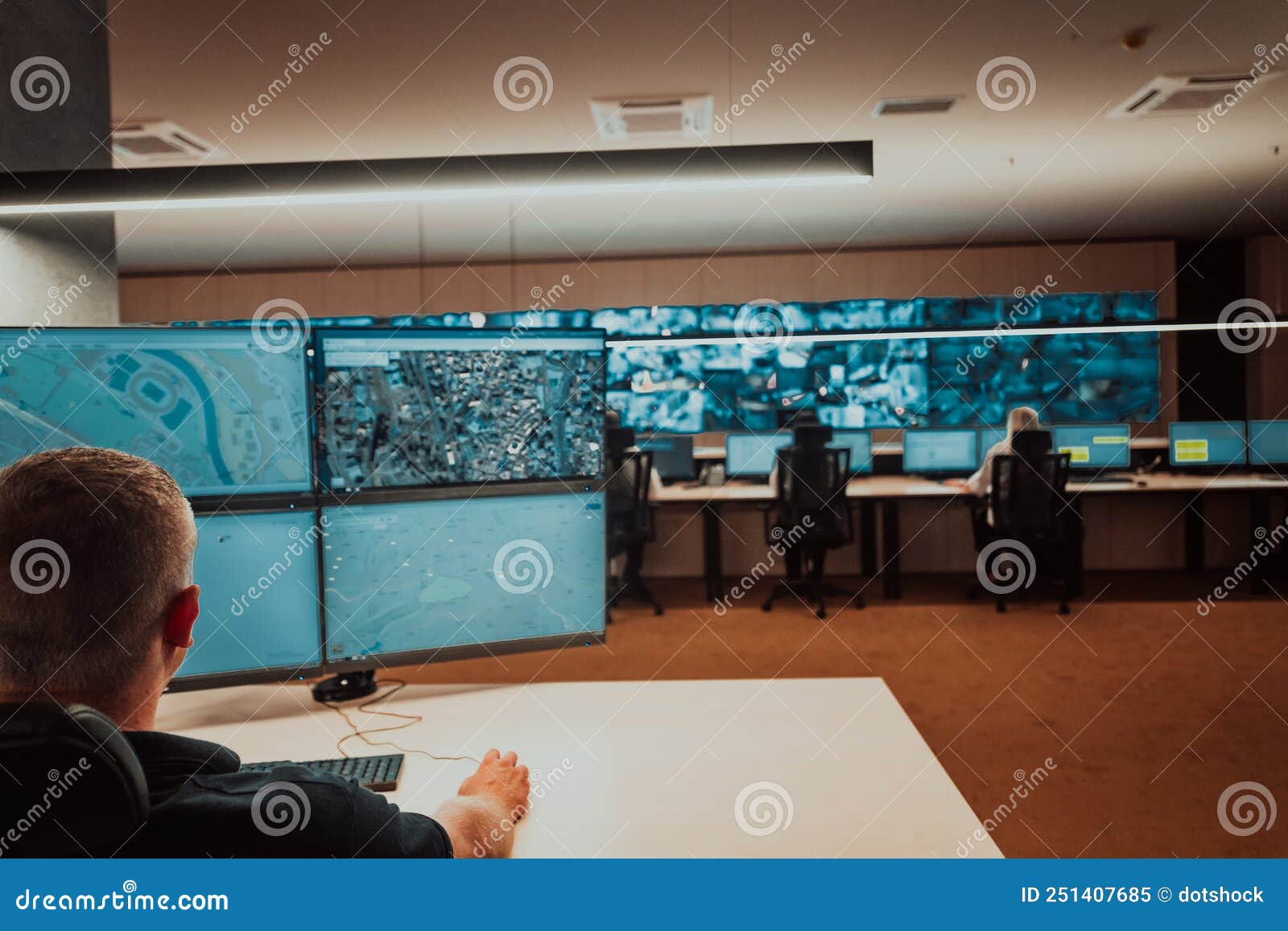 Male Security Operator Working in a Data System Control Room Offices ...