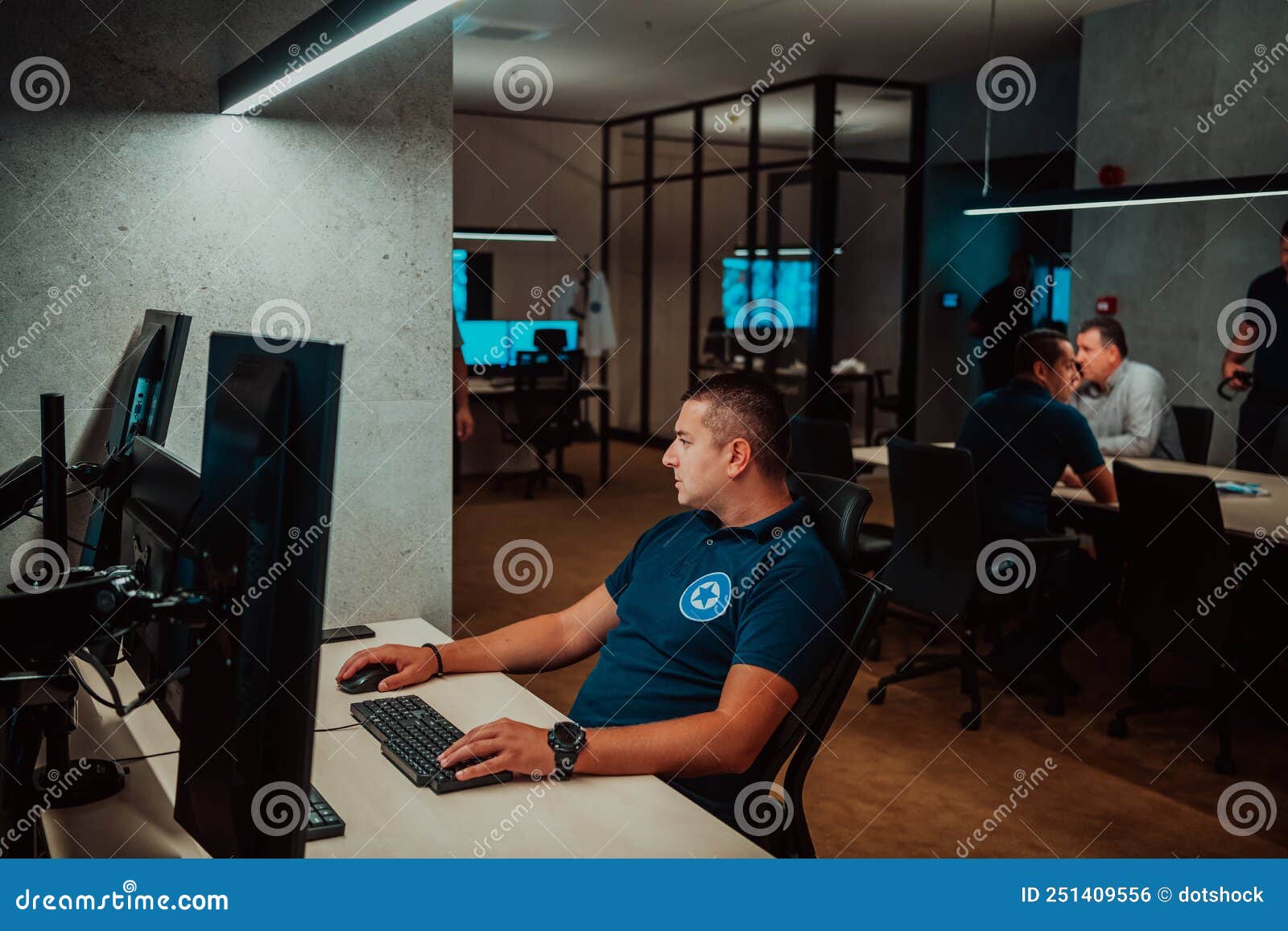 Male Security Operator Working in a Data System Control Room Offices ...