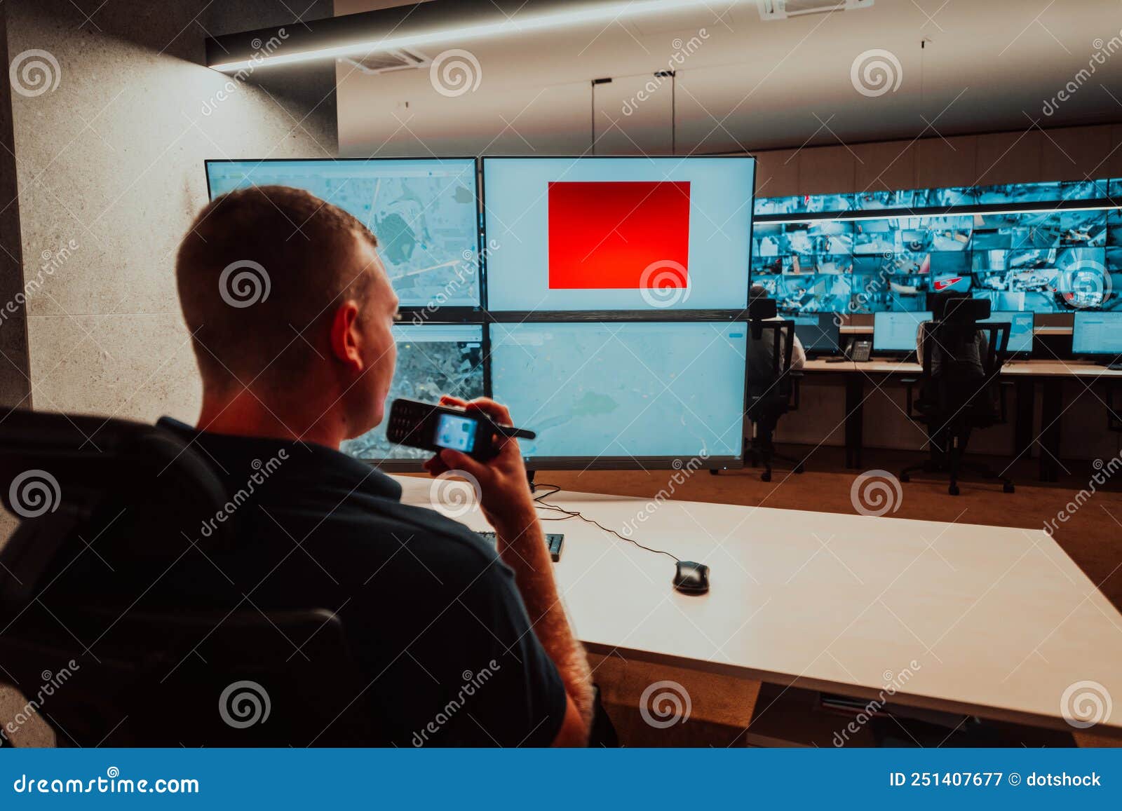 Male Security Operator Working in a Data System Control Room Offices ...