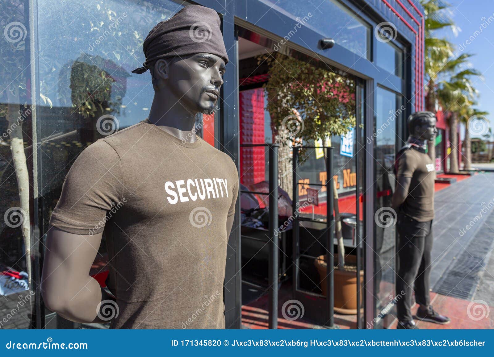 Male Security Puppet Stands on a Store Stock Photo - Image of property ...