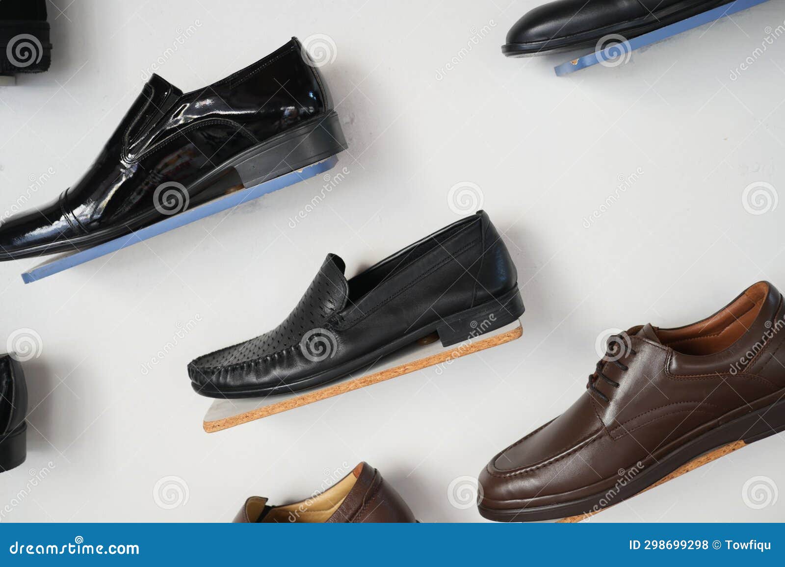 Male Shoes Lined Up on the White Background Stock Photo - Image of ...
