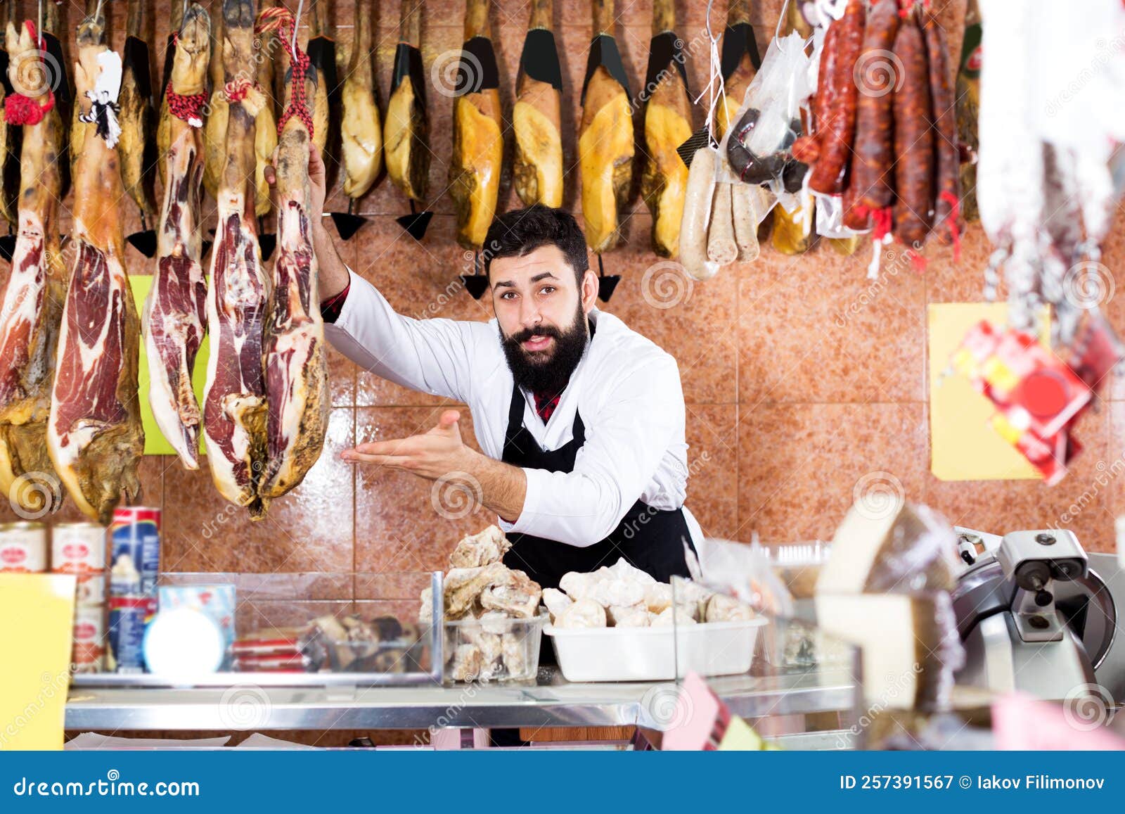 Male Shop Assistant Demonstrating Jamon Stock Image Image Of