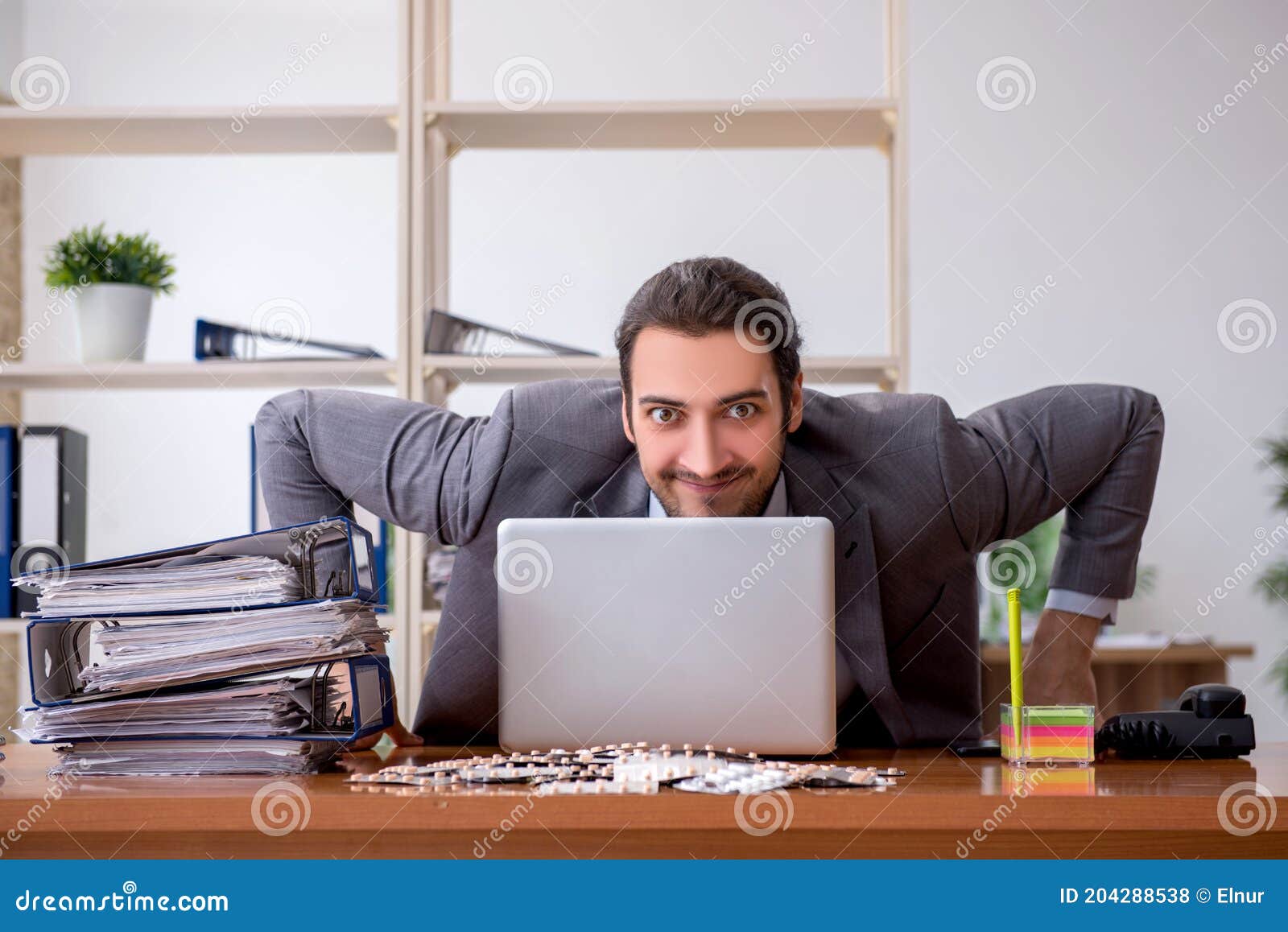 Young Male Sick Employee Suffering at Workplace Stock Photo - Image of ...