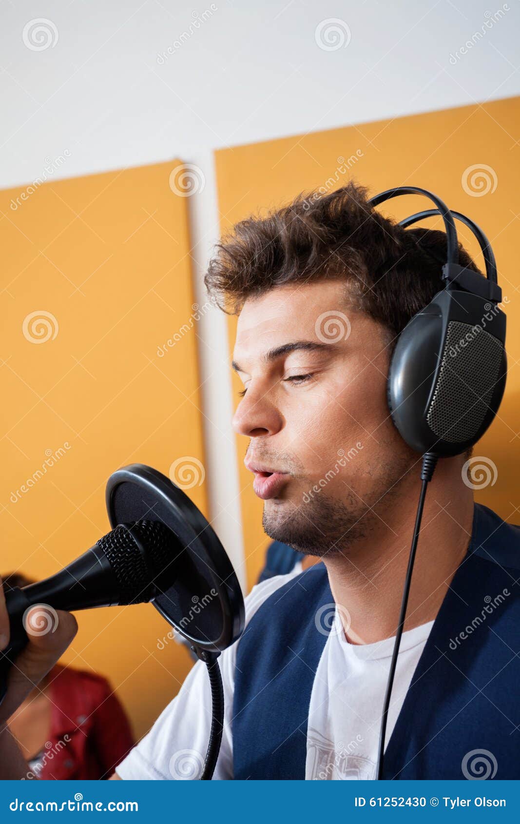 Male Singer Performing while Holding Microphone Stock Photo - Image of ...