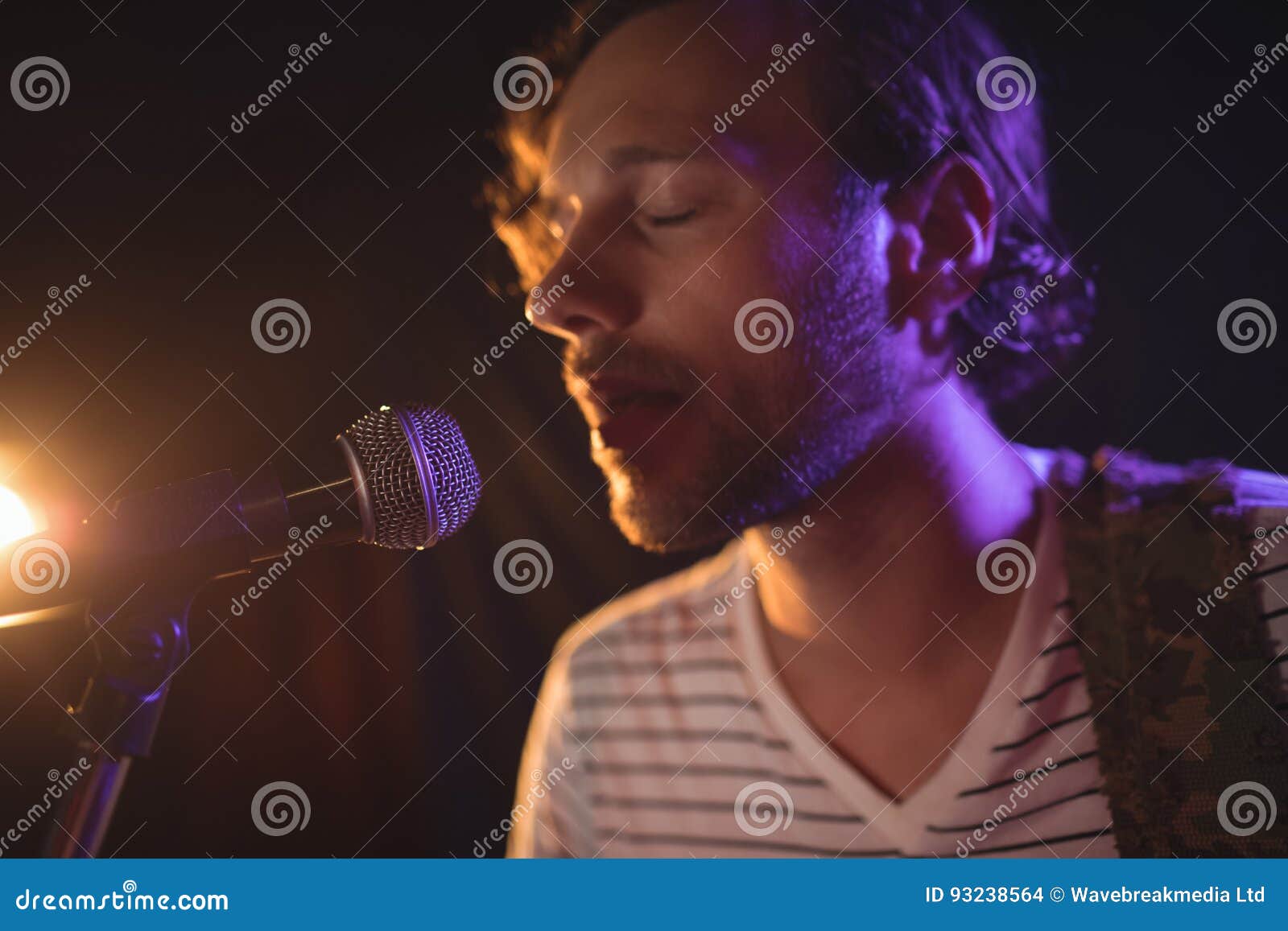 Male Singer Performing in Illuminated Nightclub Stock Photo - Image of ...