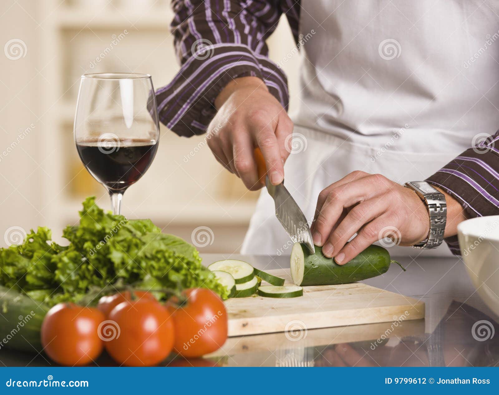 Male Slicing Cucumber for a Salad Stock Photo - Image of school ...