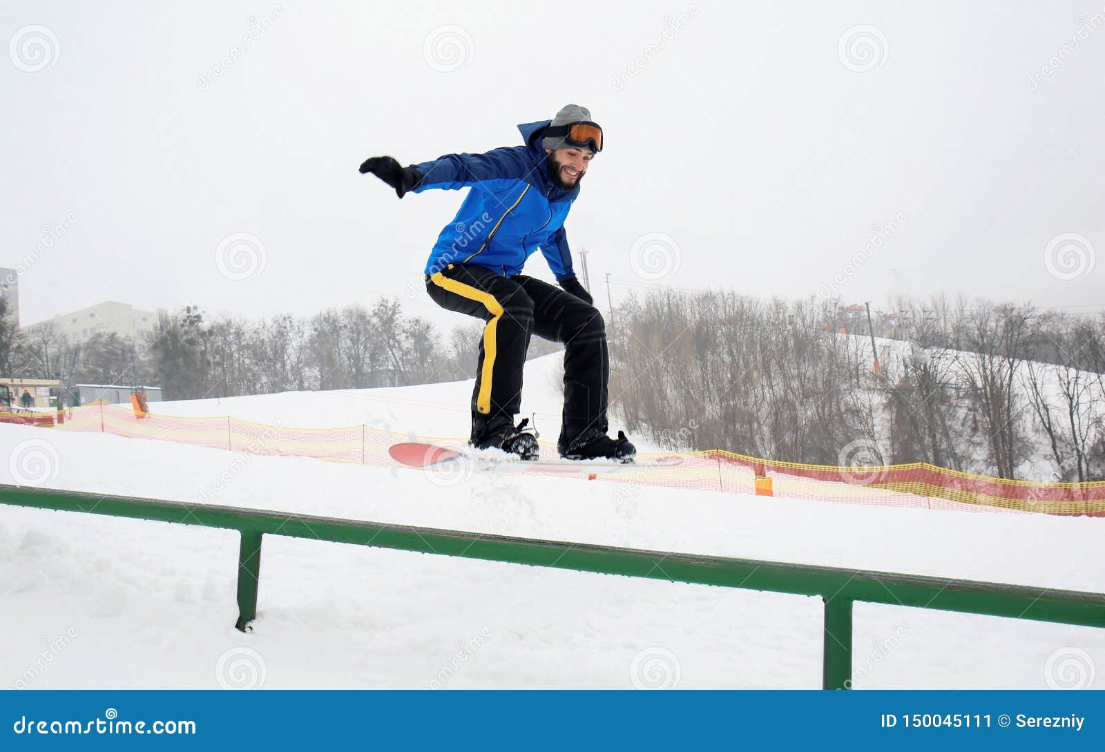 Male Snowboarder Doing Trick at Winter Resort Stock Image - Image of ...