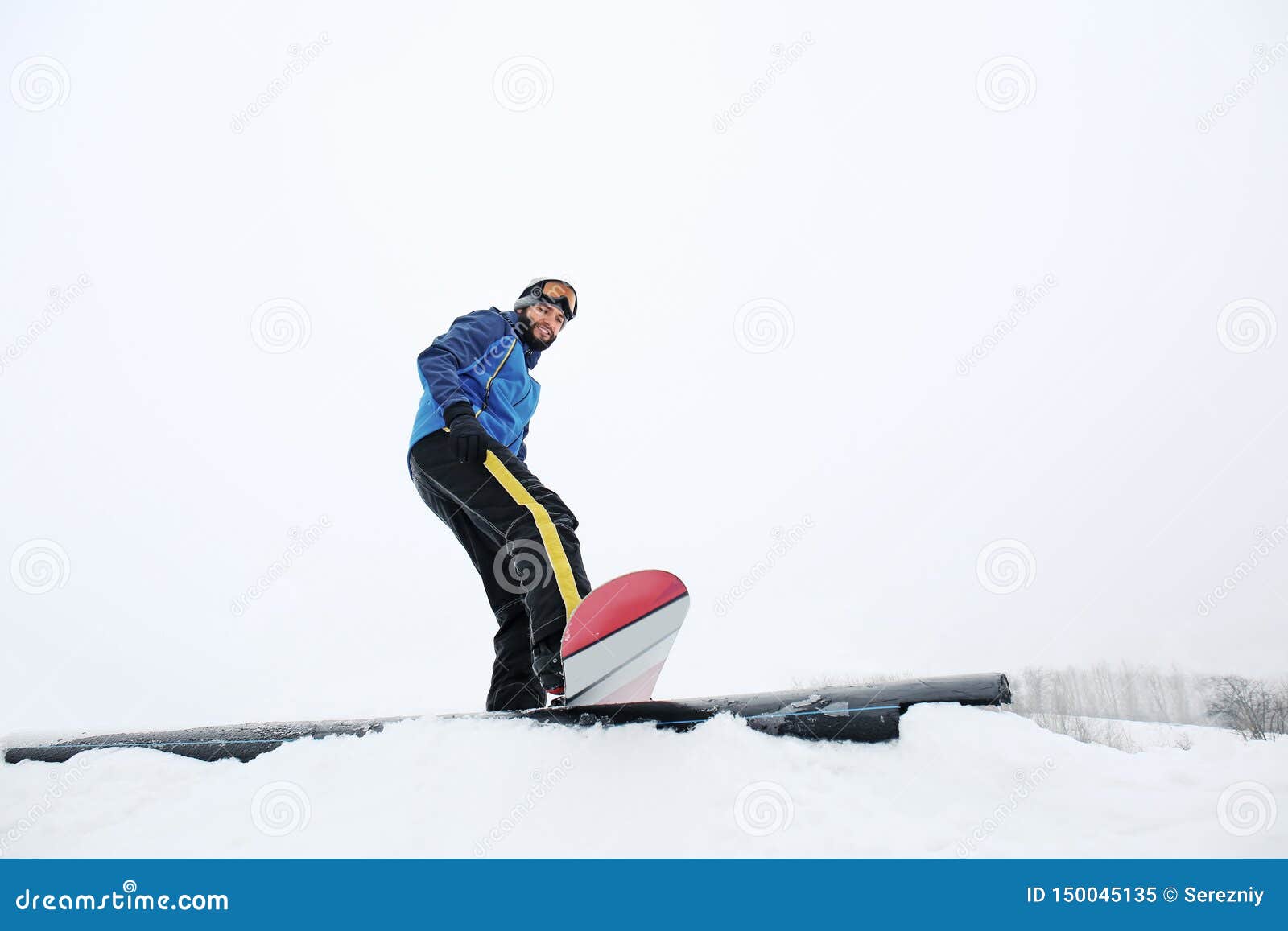 Male Snowboarder Doing Trick at Winter Resort Stock Image - Image of ...