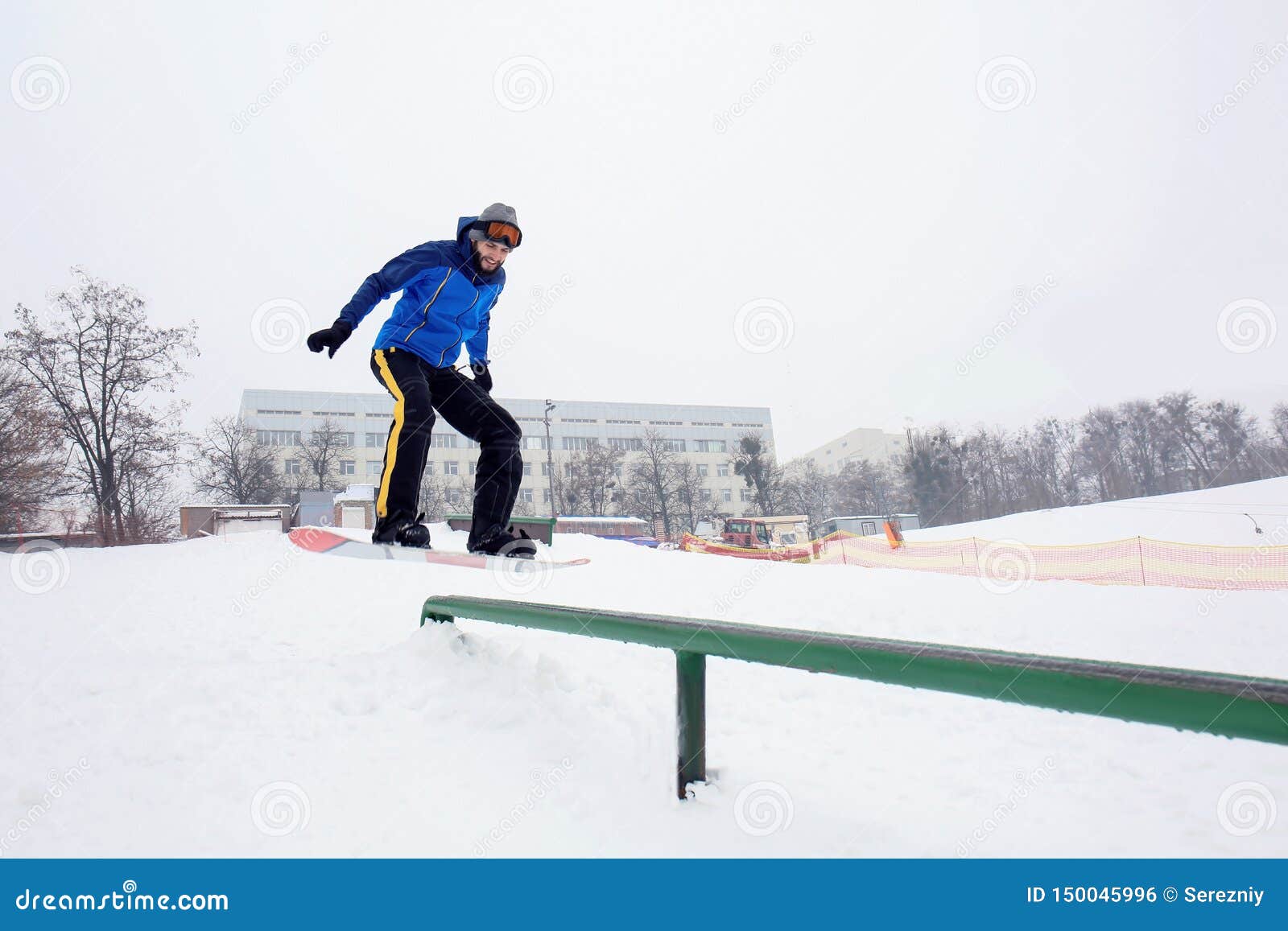 Male Snowboarder Doing Trick at Winter Resort Stock Photo - Image of ...