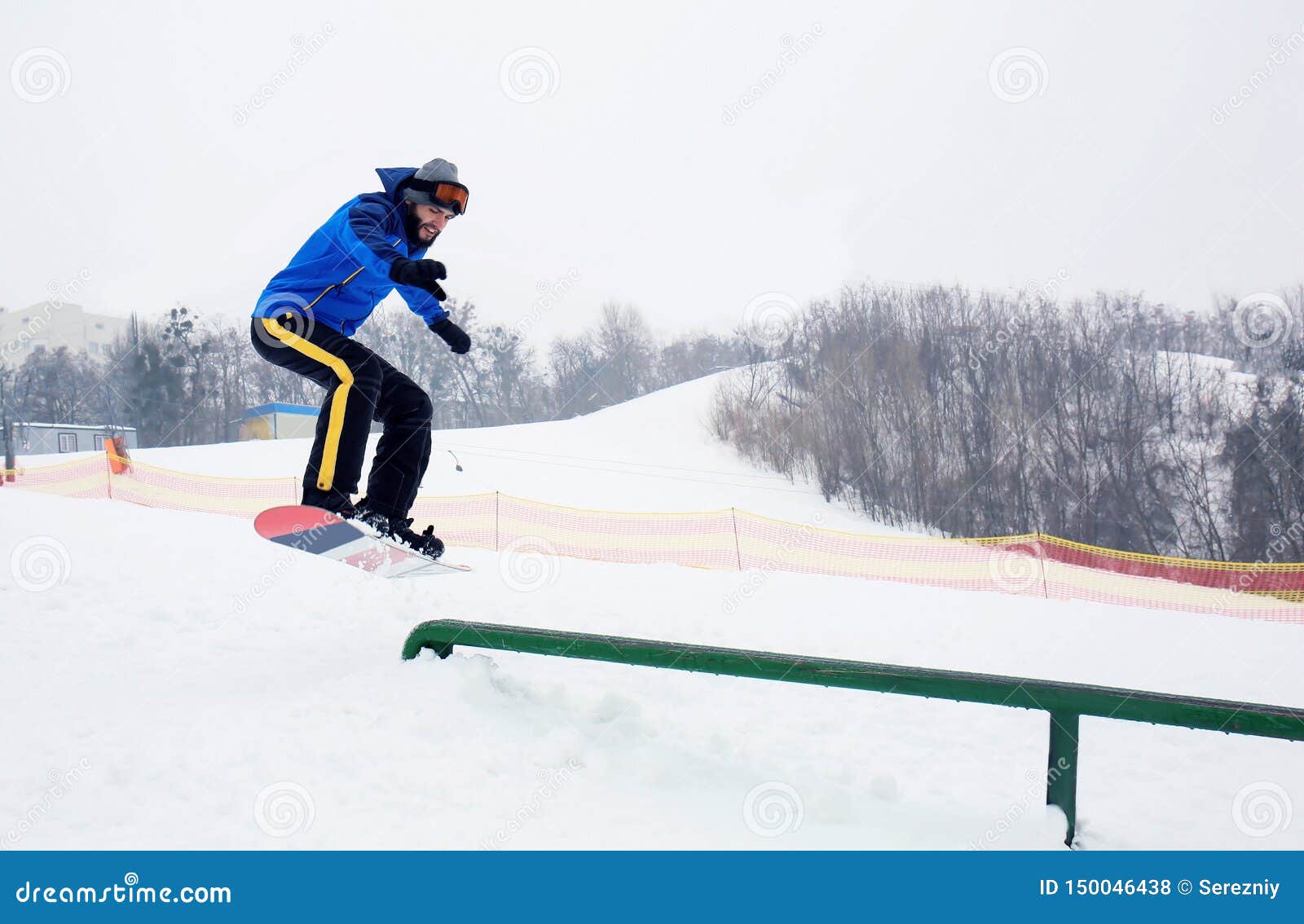 Male Snowboarder Doing Trick at Winter Resort Stock Photo - Image of ...